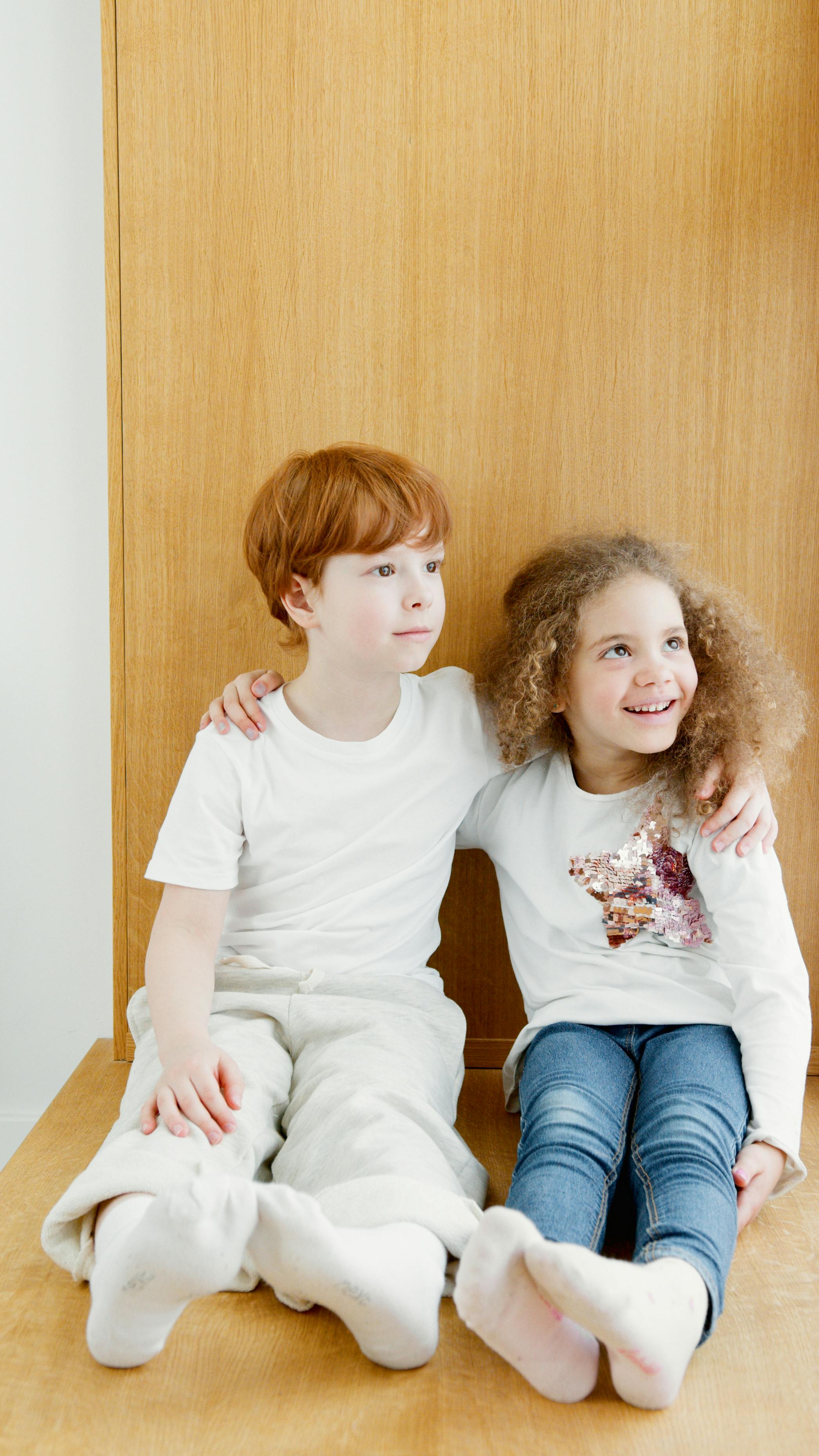 A Girl and a Boy Putting Arms Around Each Other's Shoulder · Free Stock ...