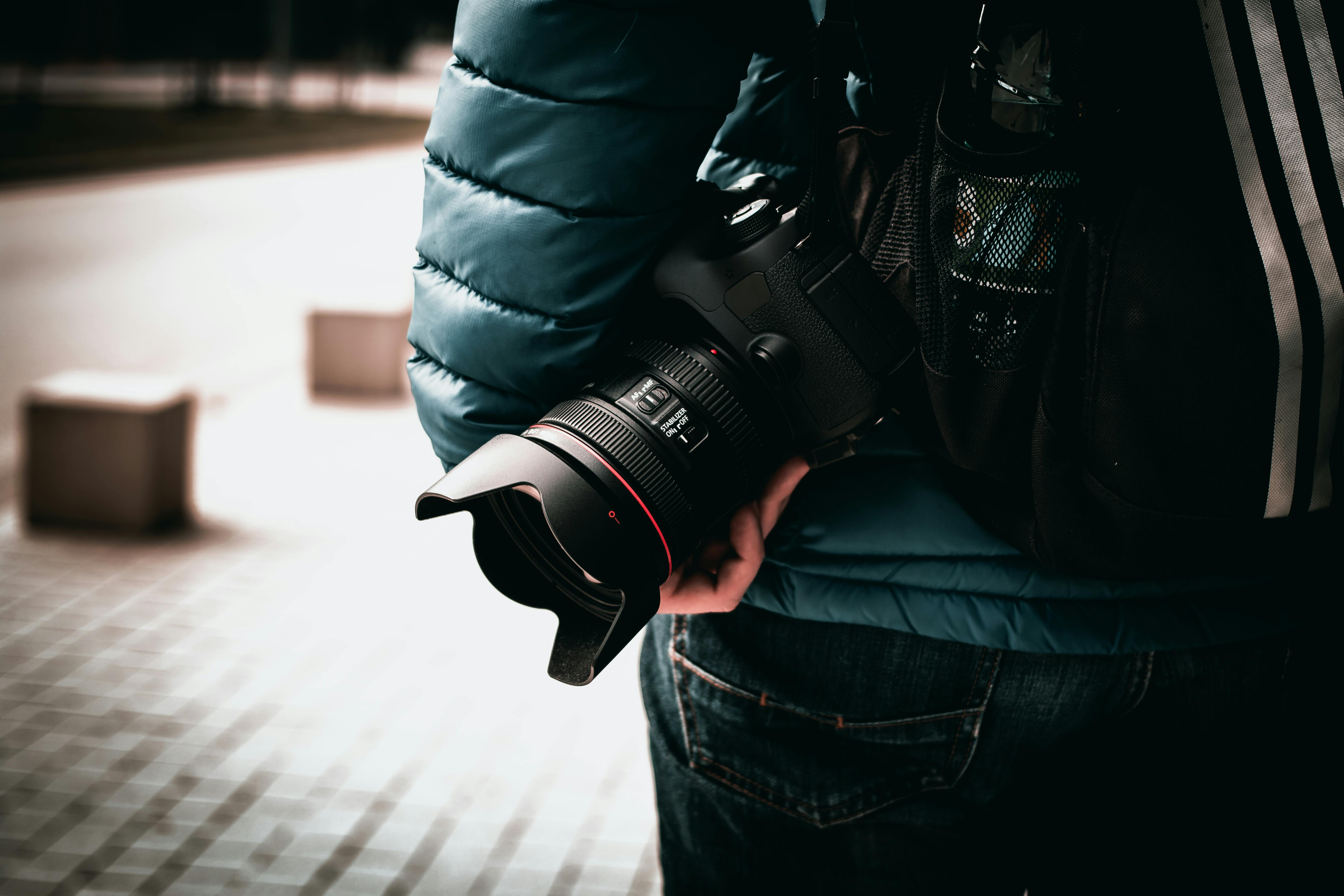 Close-up Photo of Woman Viewing Photos from Her Camera Near Body of ...