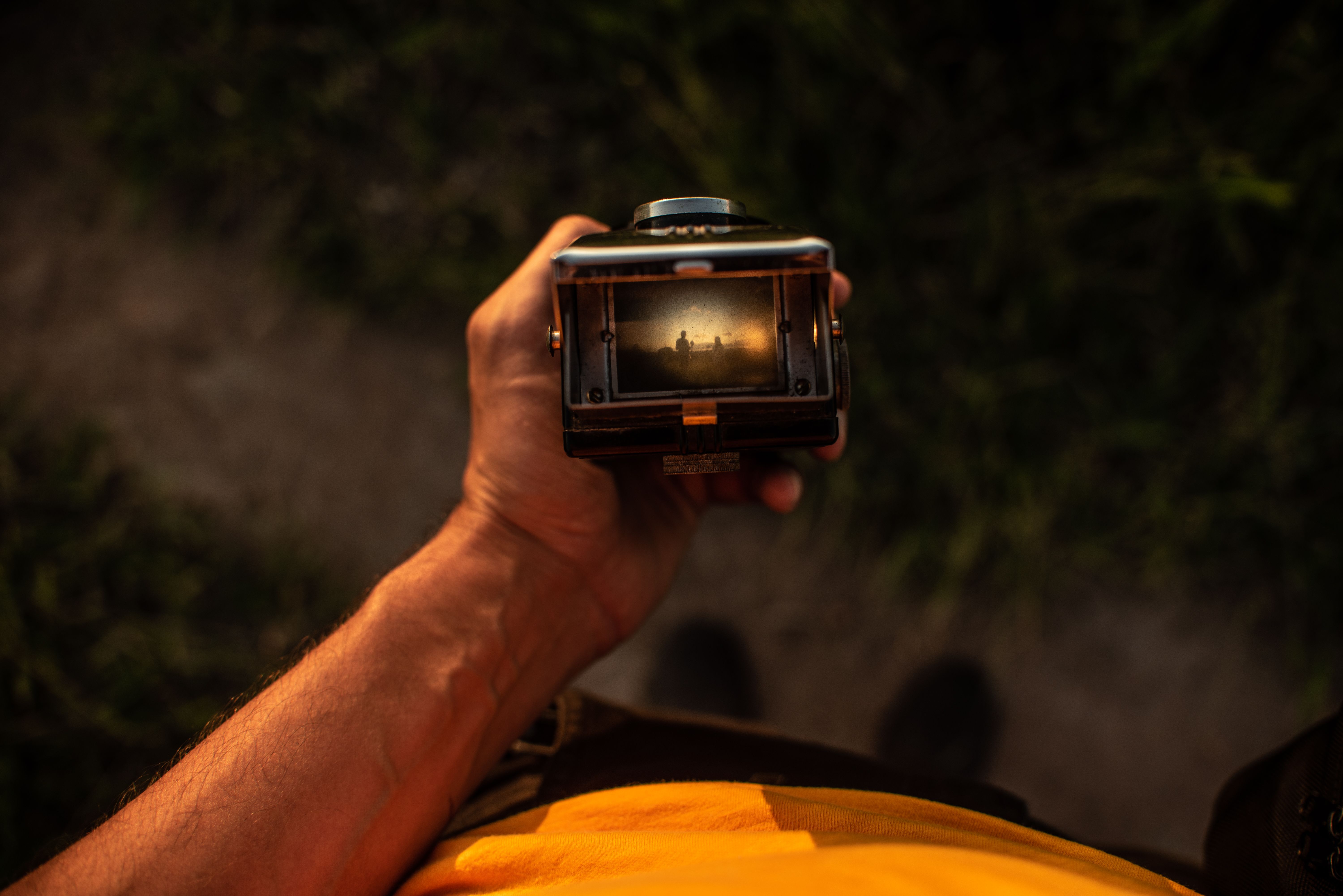Professional photographer taking photo from metal construction · Free ...