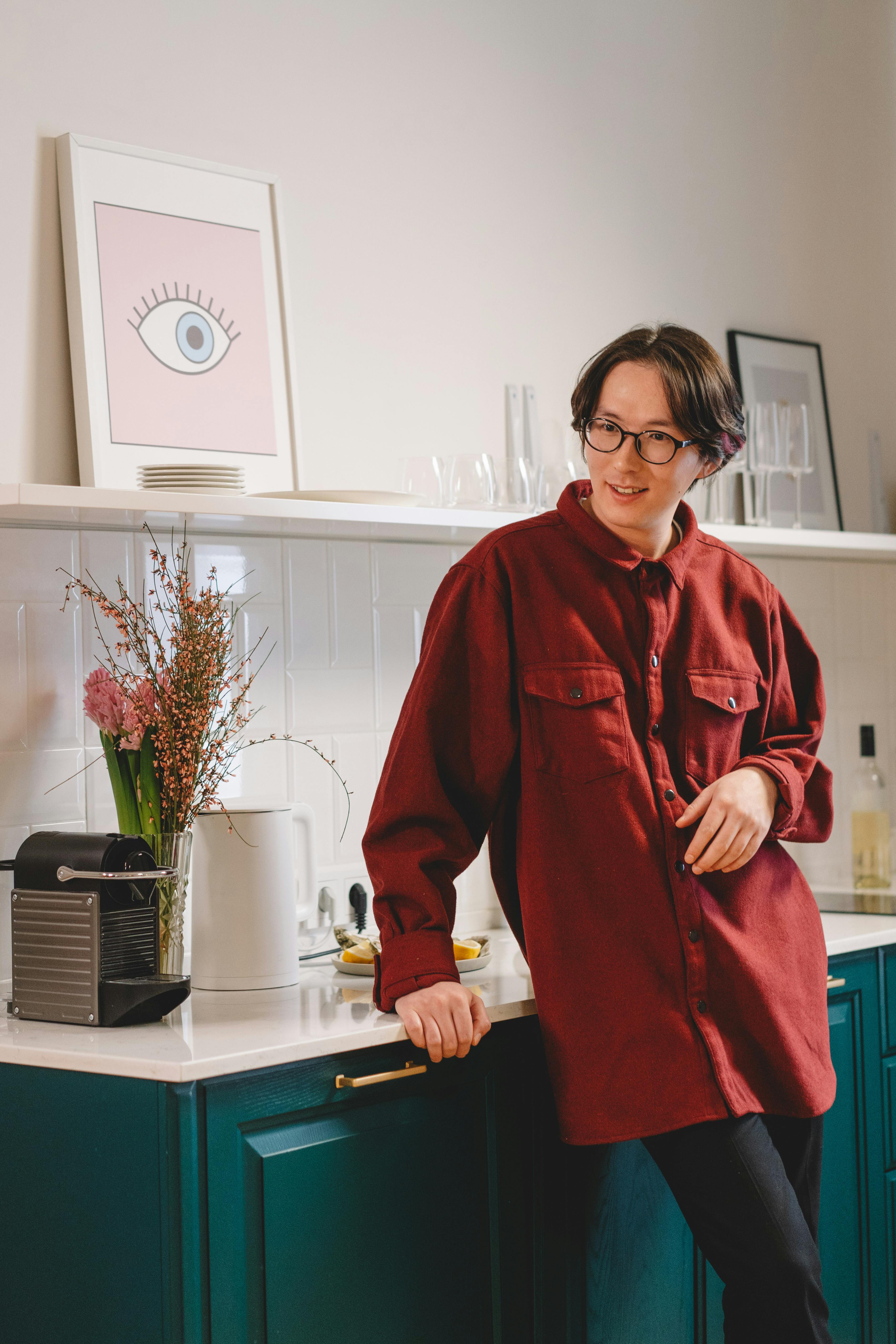 Man Leaning on a Kitchen Counter · Free Stock Photo