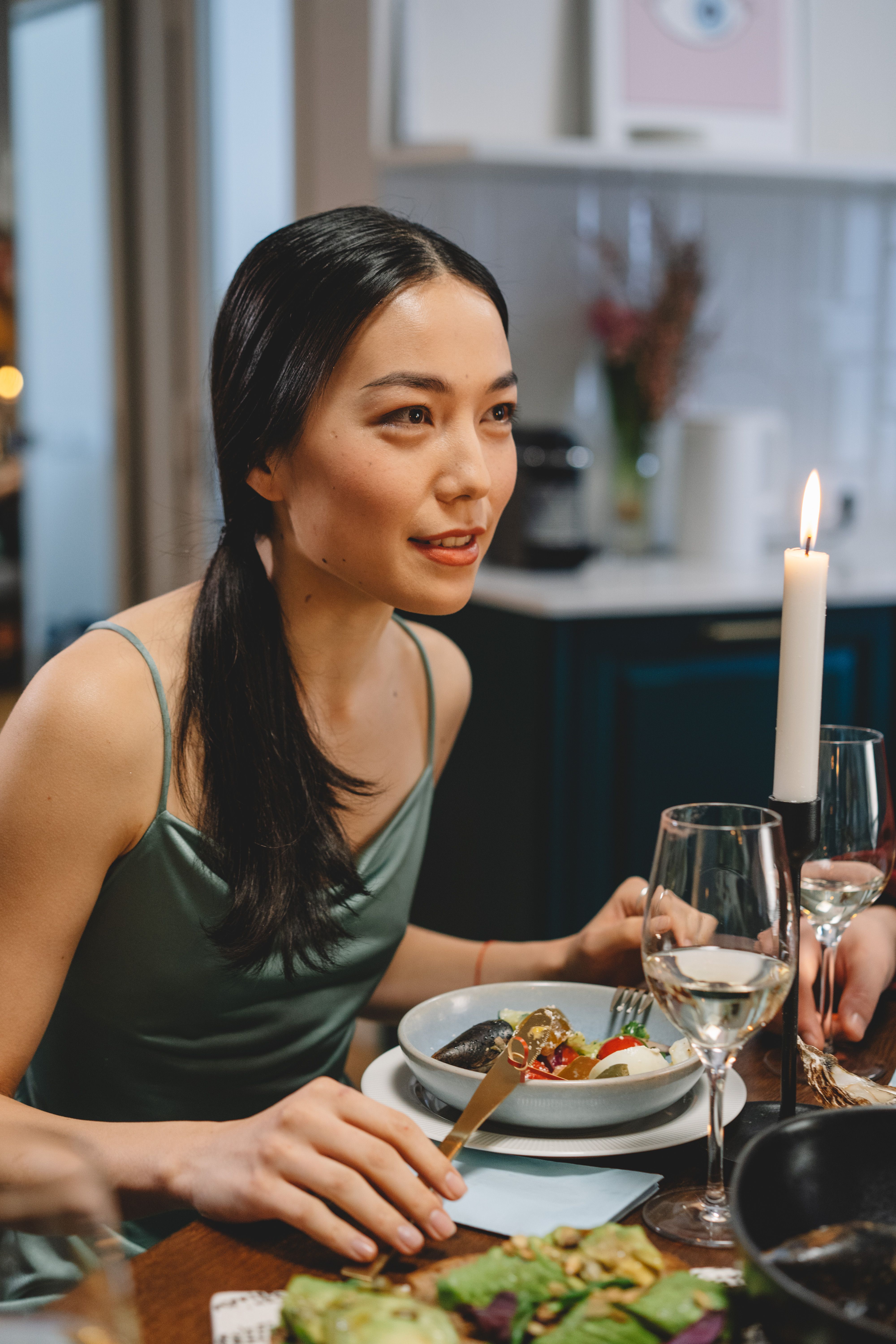 A Woman in Gray Dress Having Dinner · Free Stock Photo