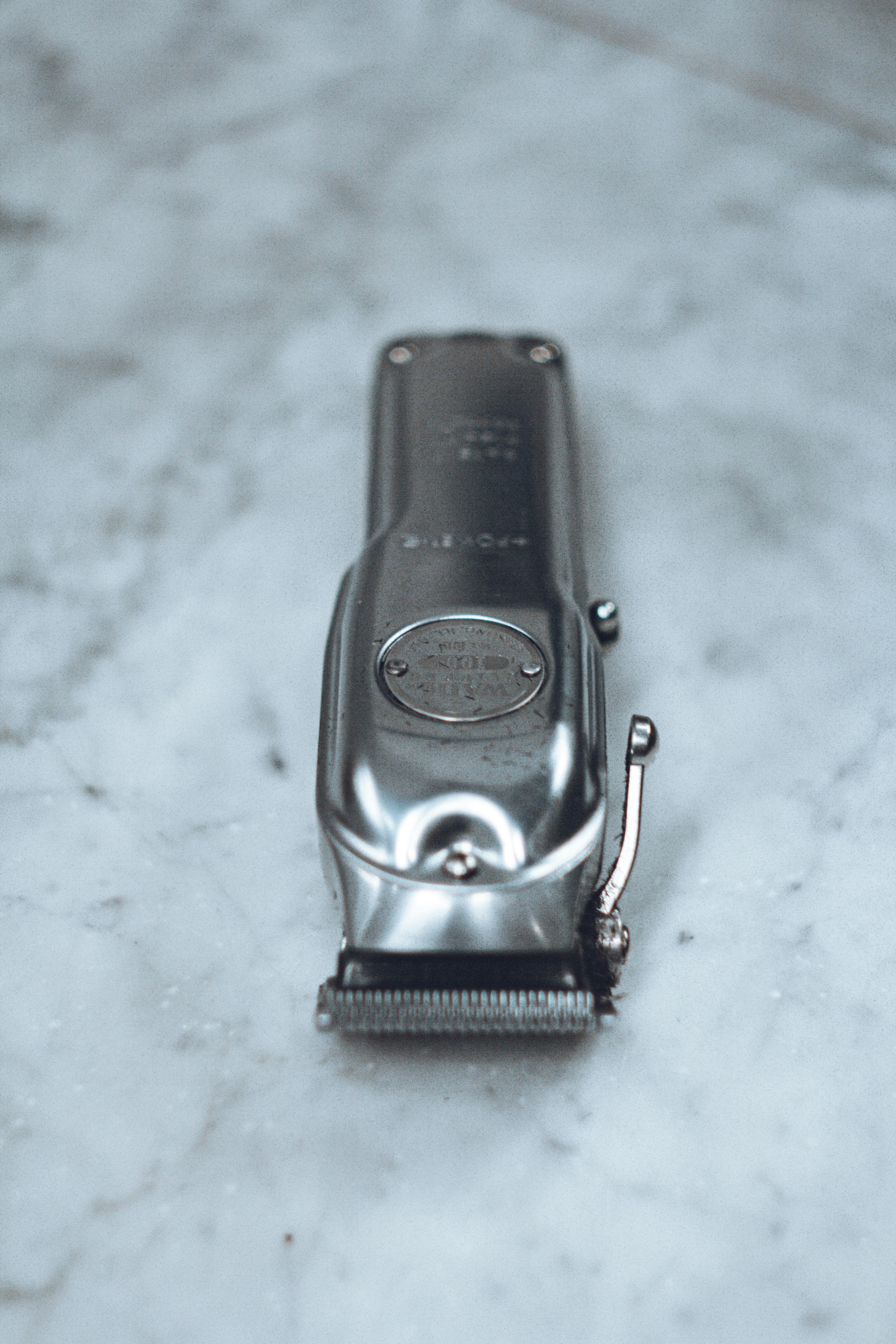 A Close-Up Shot of a Silver Hair Clipper · Free Stock Photo