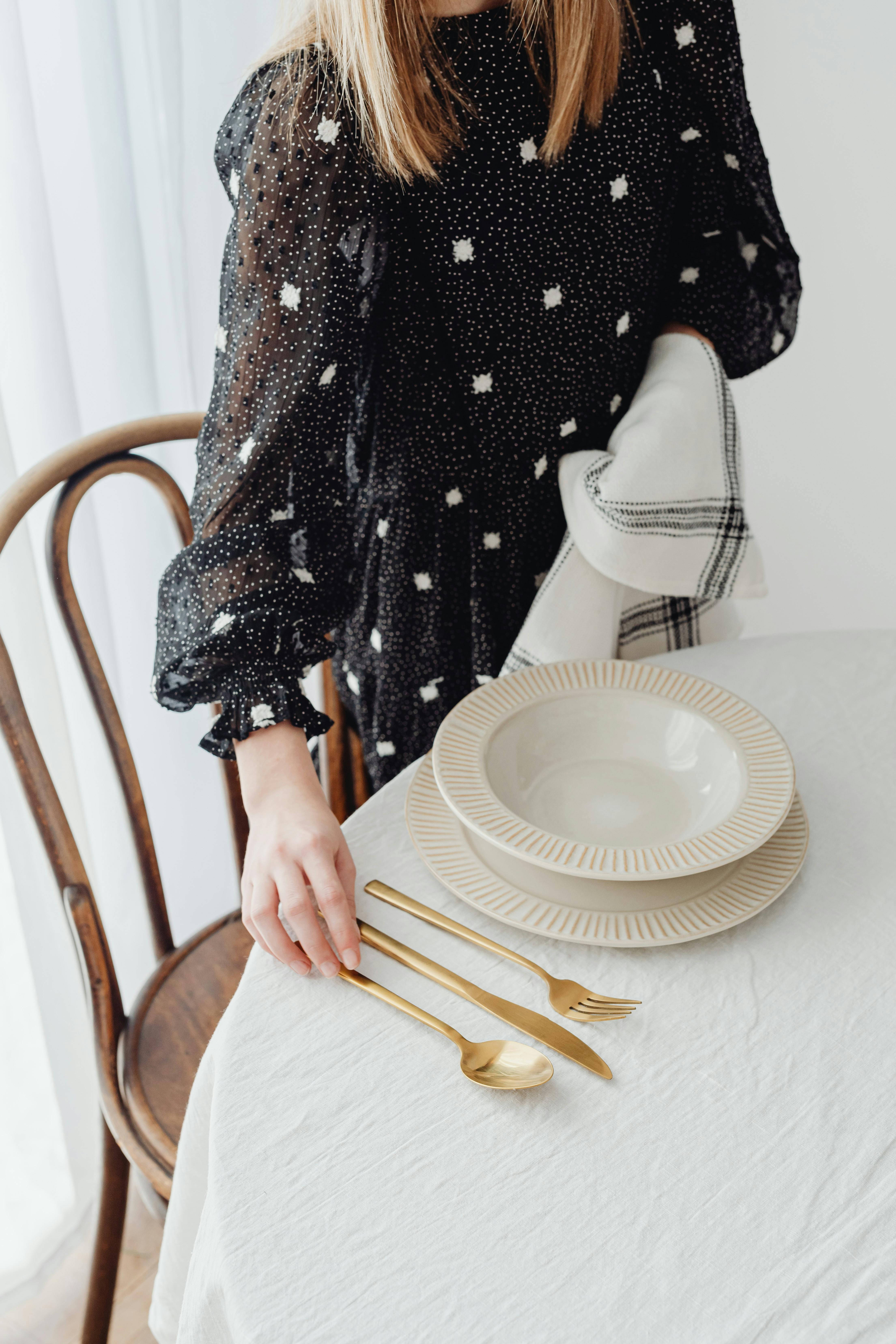 A Woman Setting the Dining Table · Free Stock Photo