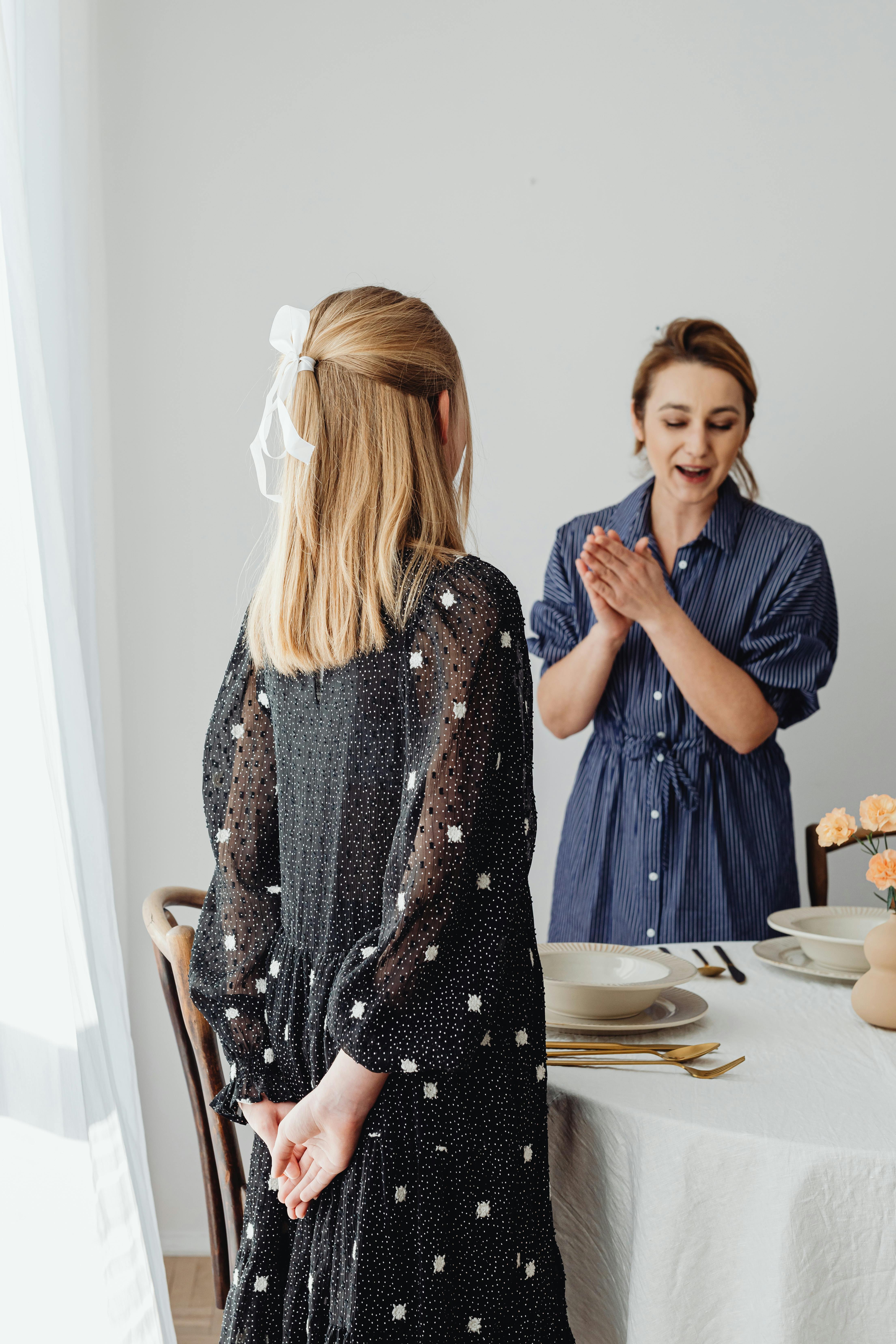 Women Standing Beside the Dining Table · Free Stock Photo