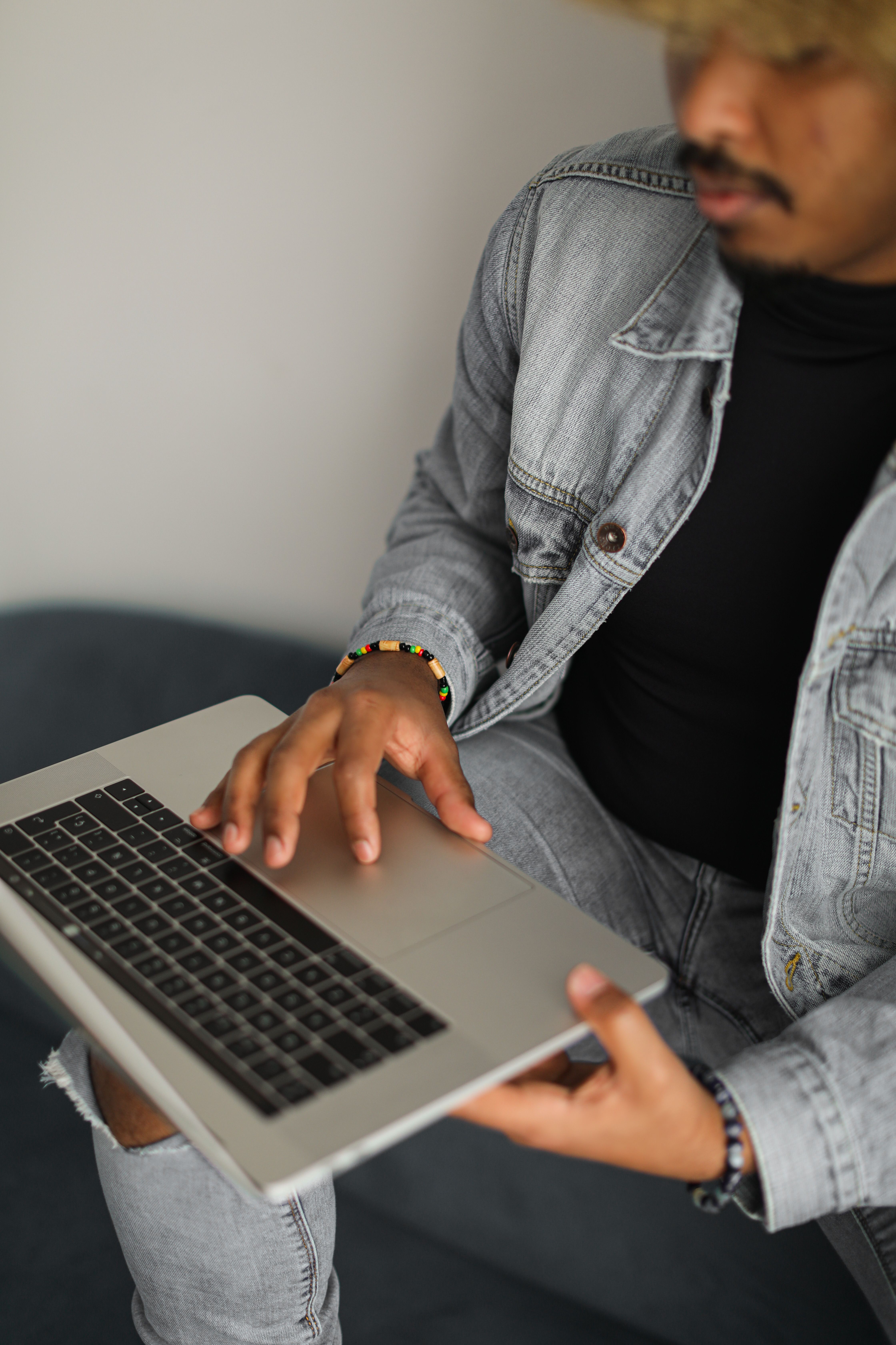 A Person Browsing Images in a Laptop · Free Stock Photo