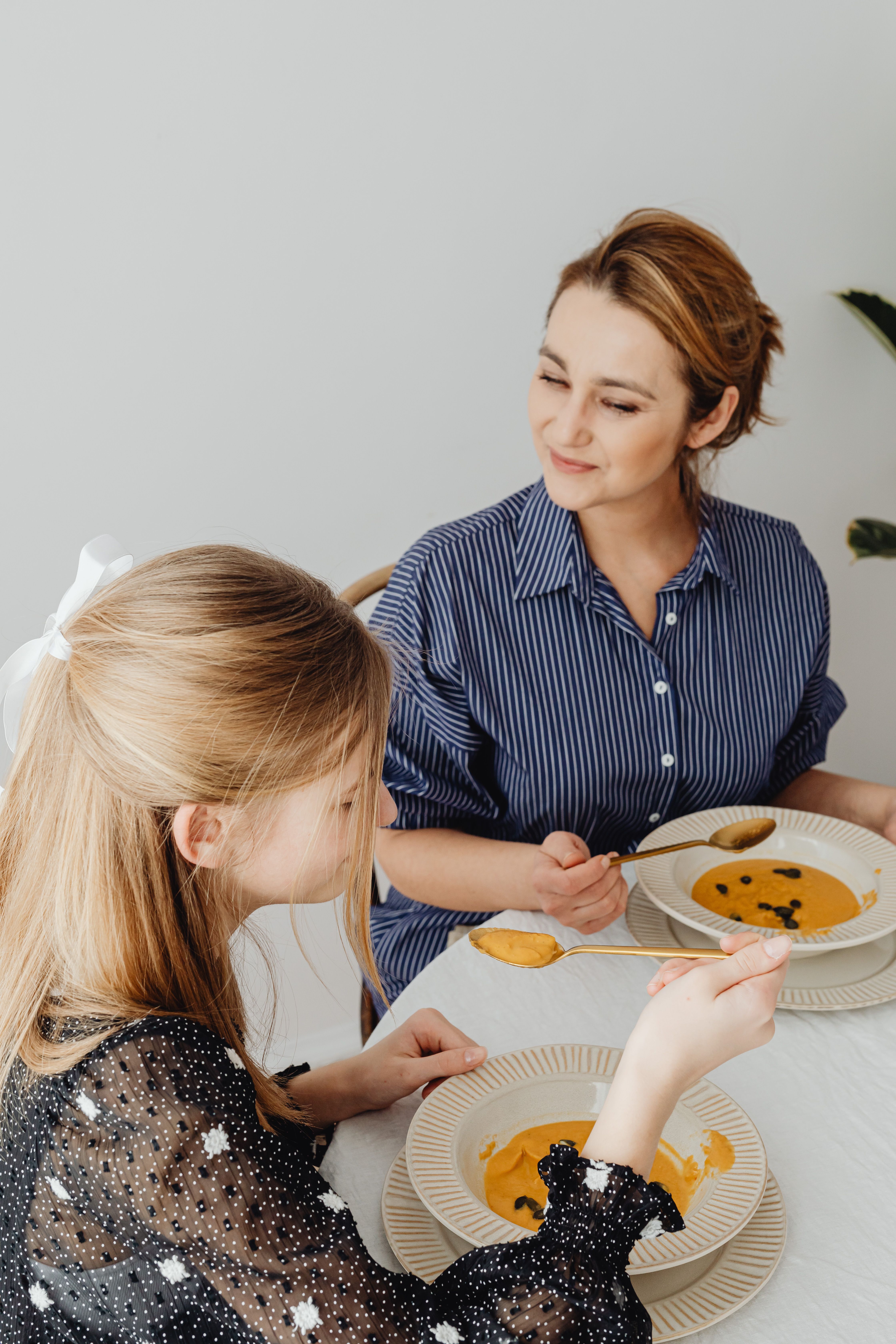 Mom And Daughter Having Soup Photos, Download The BEST Free Mom And ...