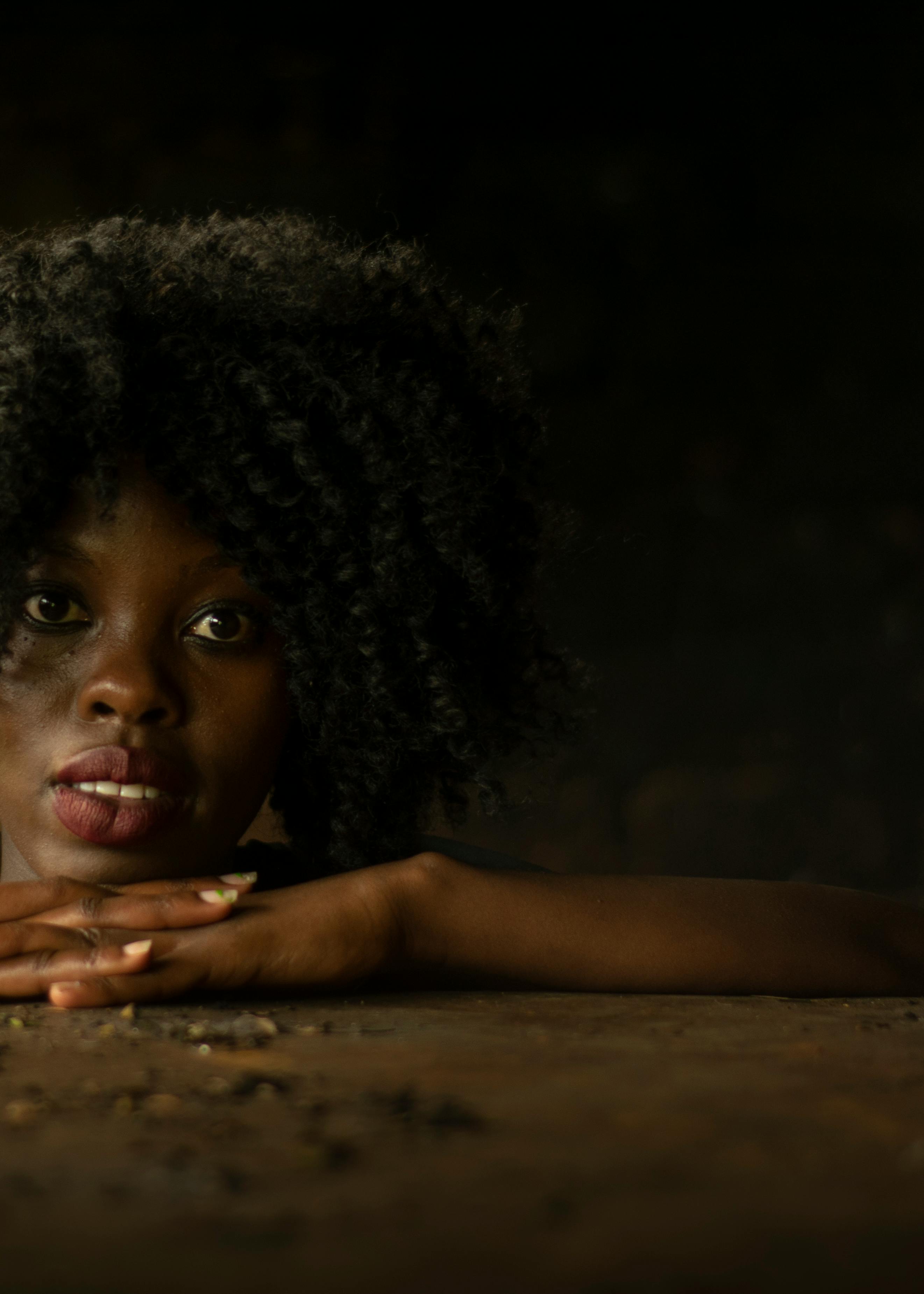 Woman Posing with Her Head Resting on Her Hands · Free Stock Photo