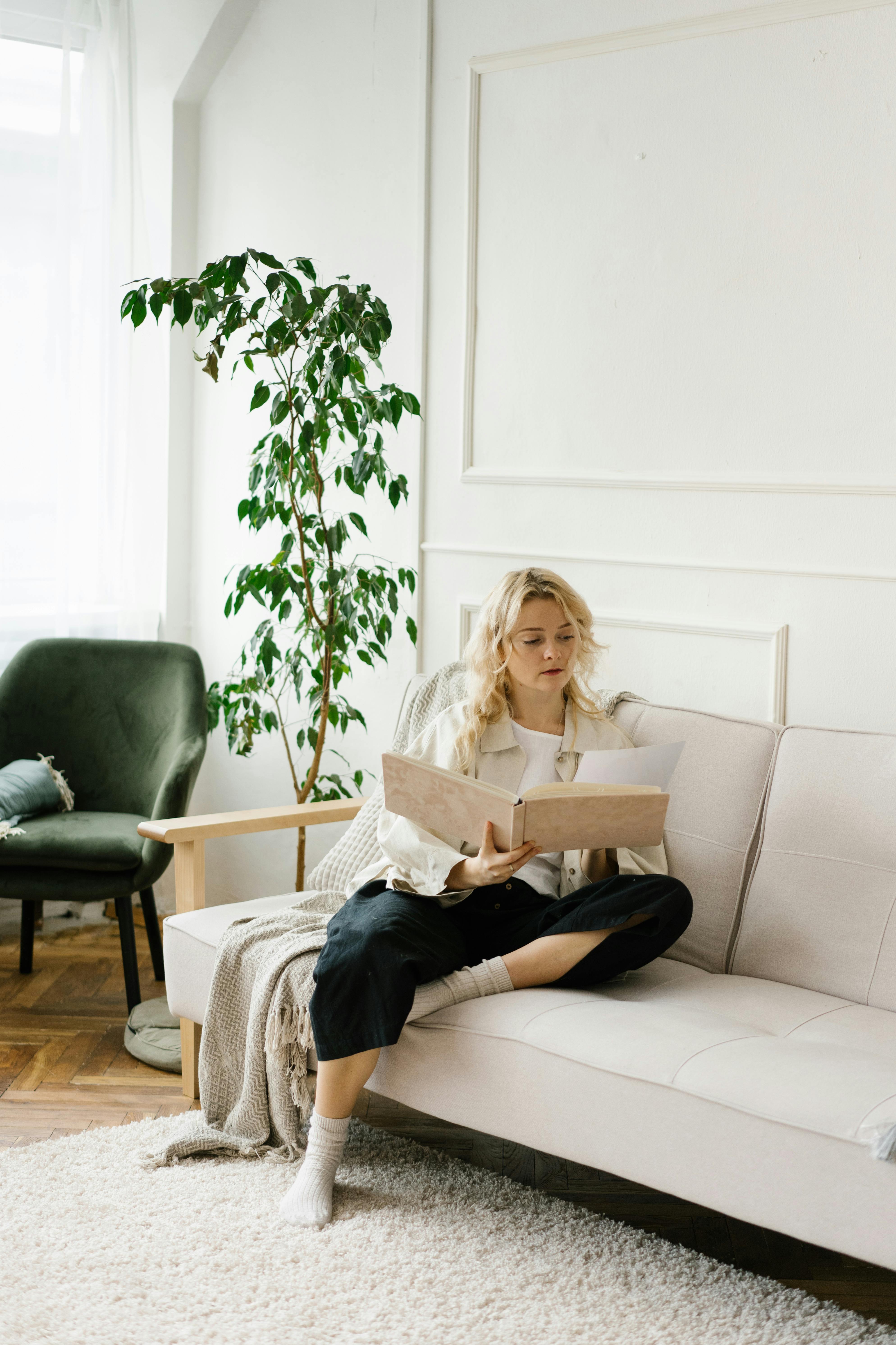 Woman Looking at a Book · Free Stock Photo