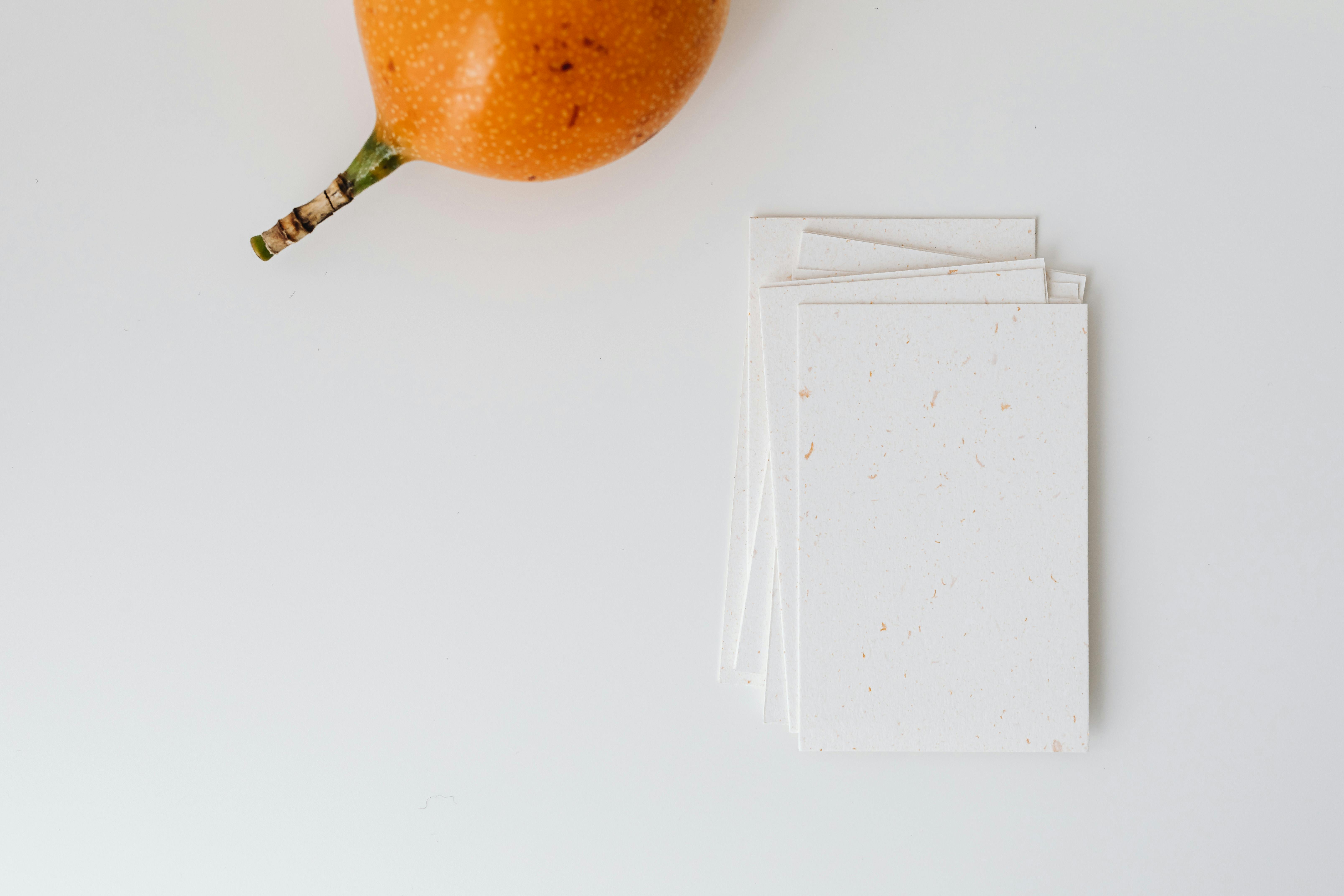 Yellow Fruit and White Handmade Paper · Free Stock Photo