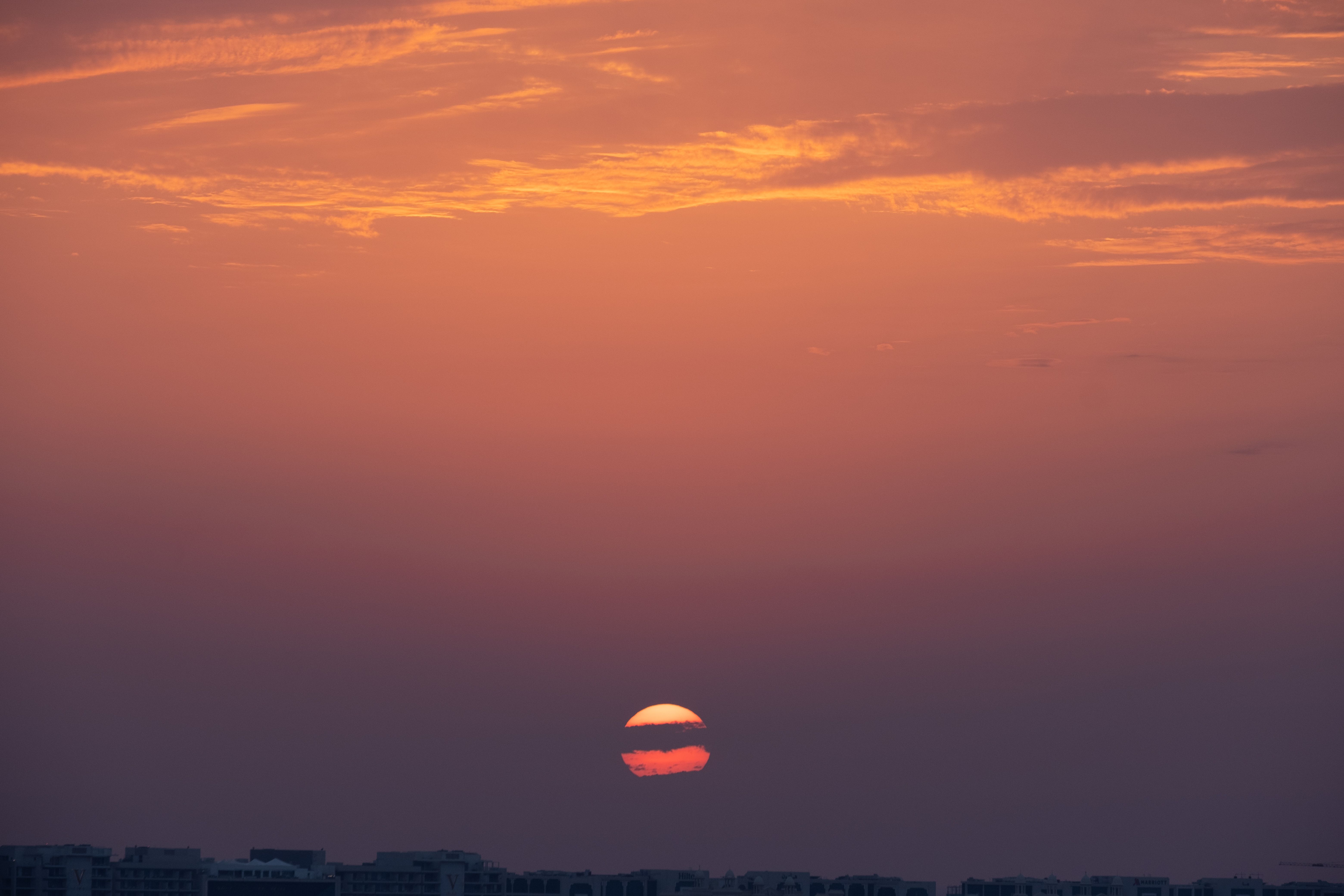 A Sun Setting Over a City · Free Stock Photo