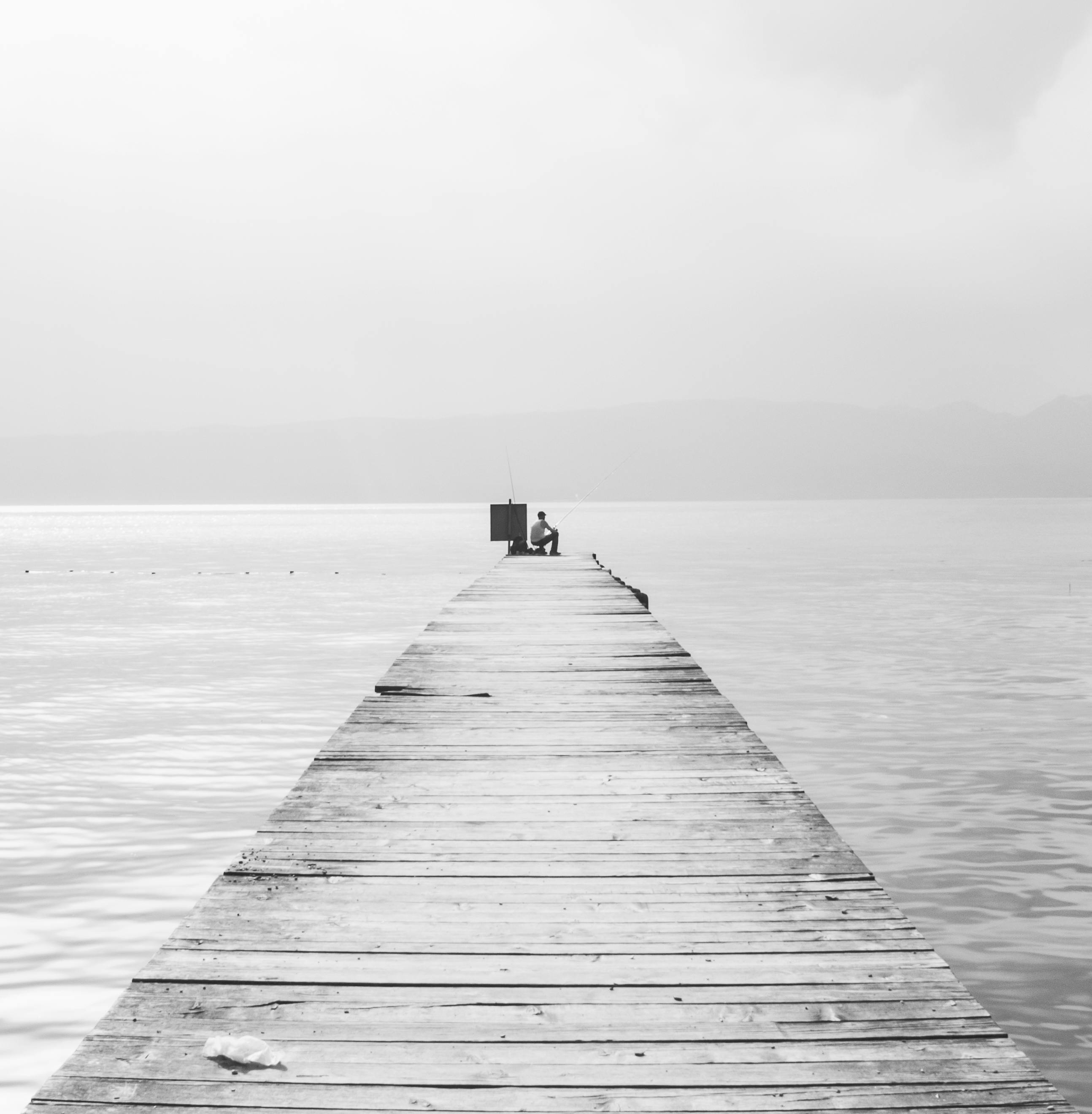 Grayscale Photo of Wooden Dock on Sea · Free Stock Photo