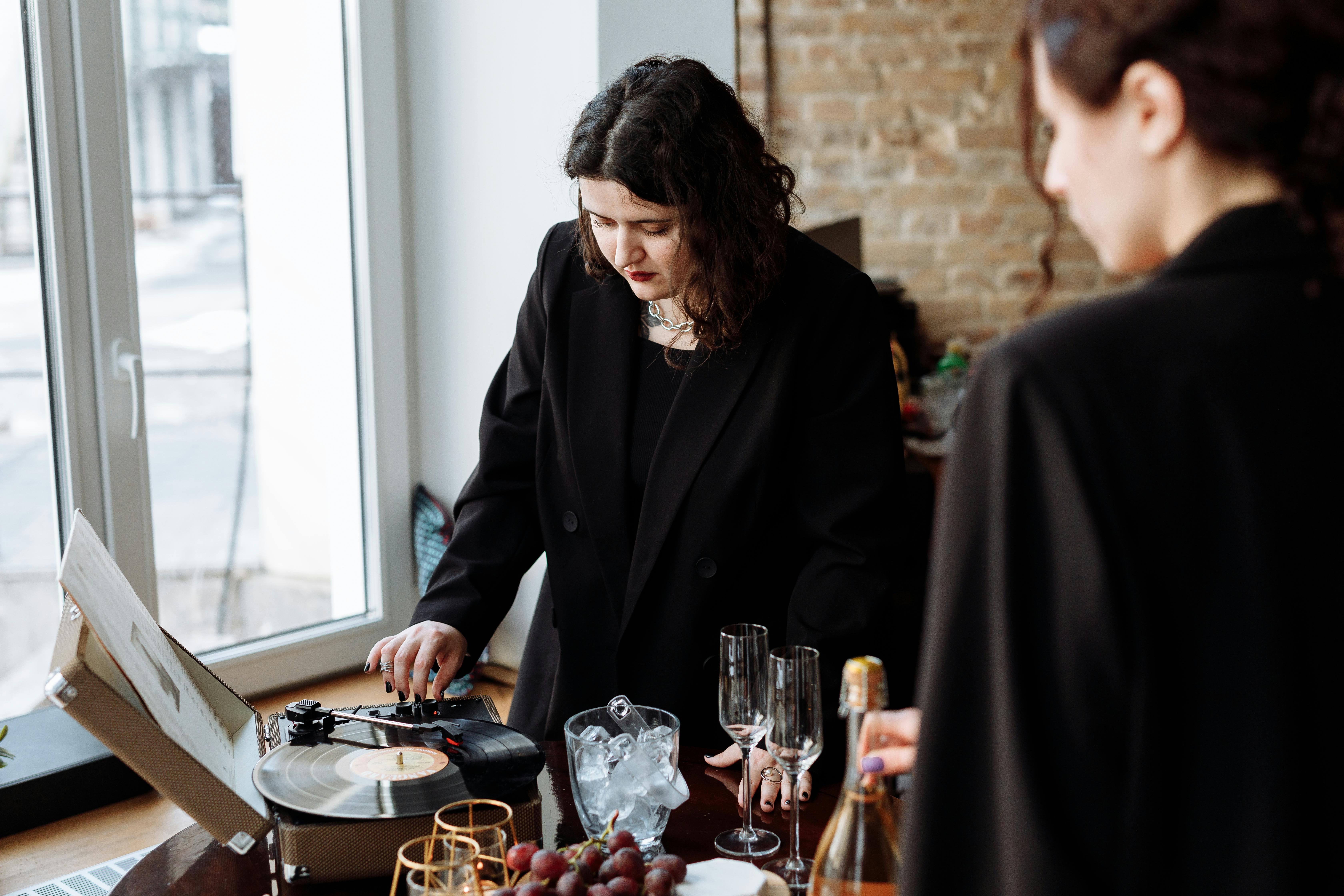 A Woman Standing Near the Table · Free Stock Photo