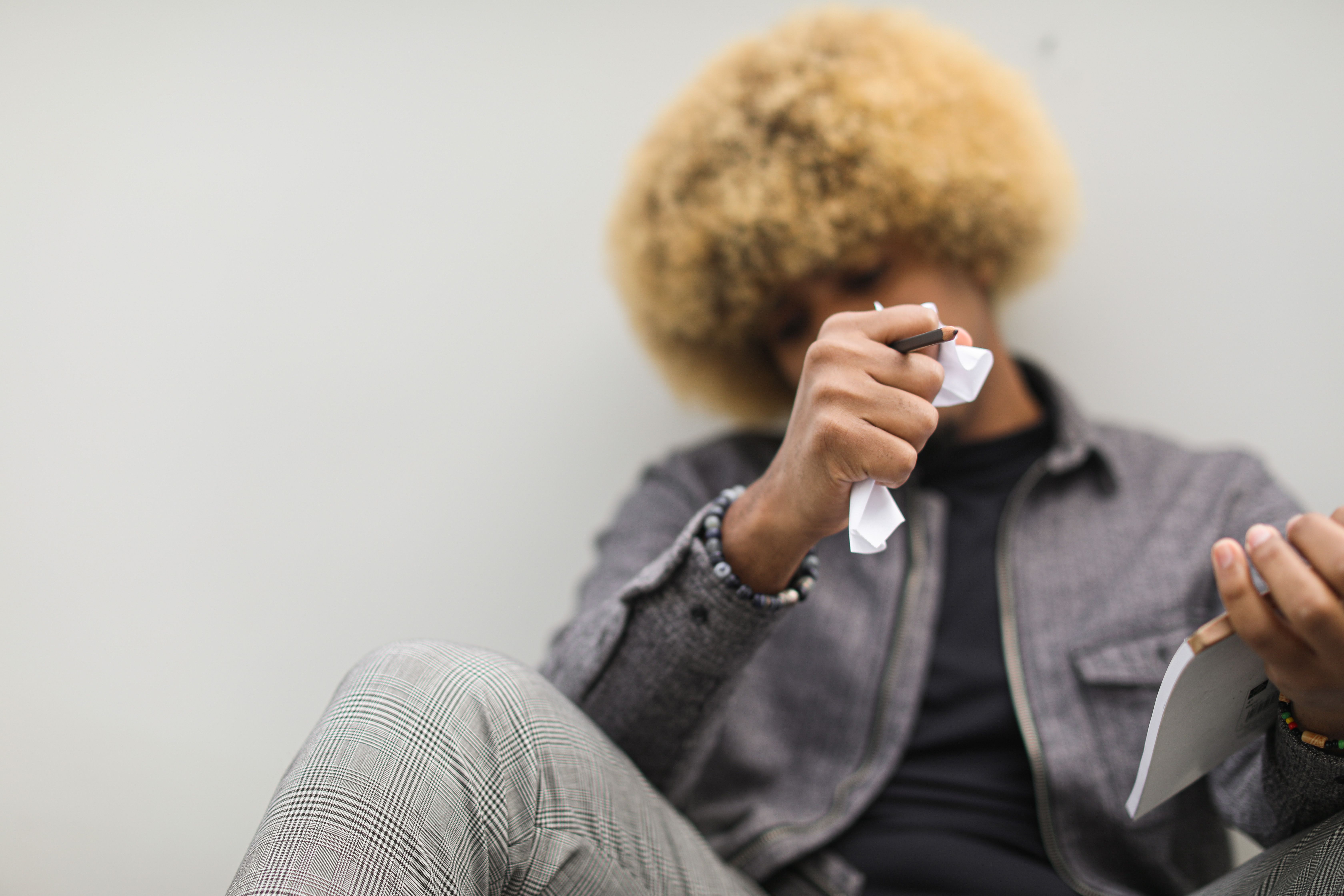 Colored Hair Person Crumpling the Paper · Free Stock Photo