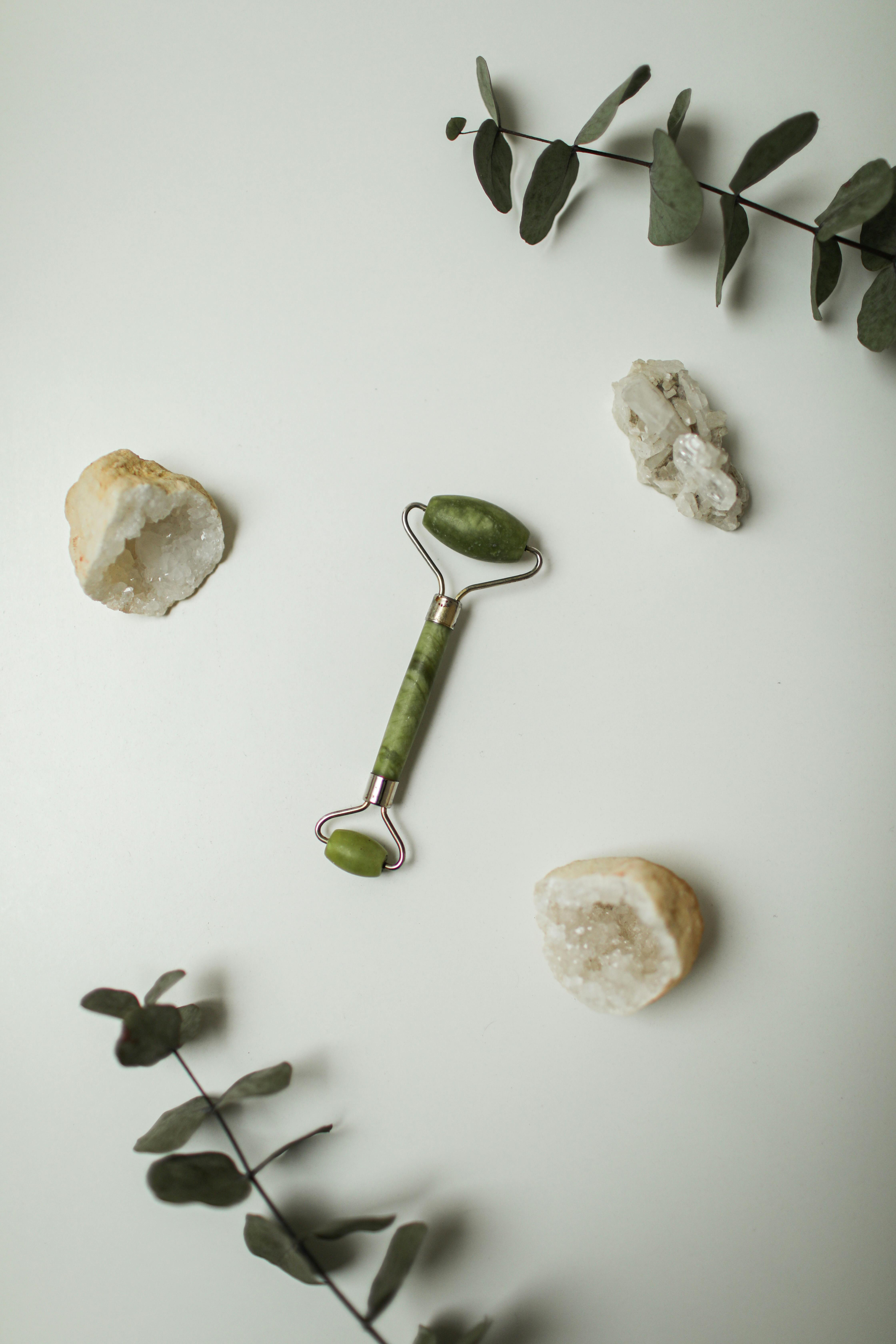 A Flatlay of Crystals and a Facial Roller · Free Stock Photo