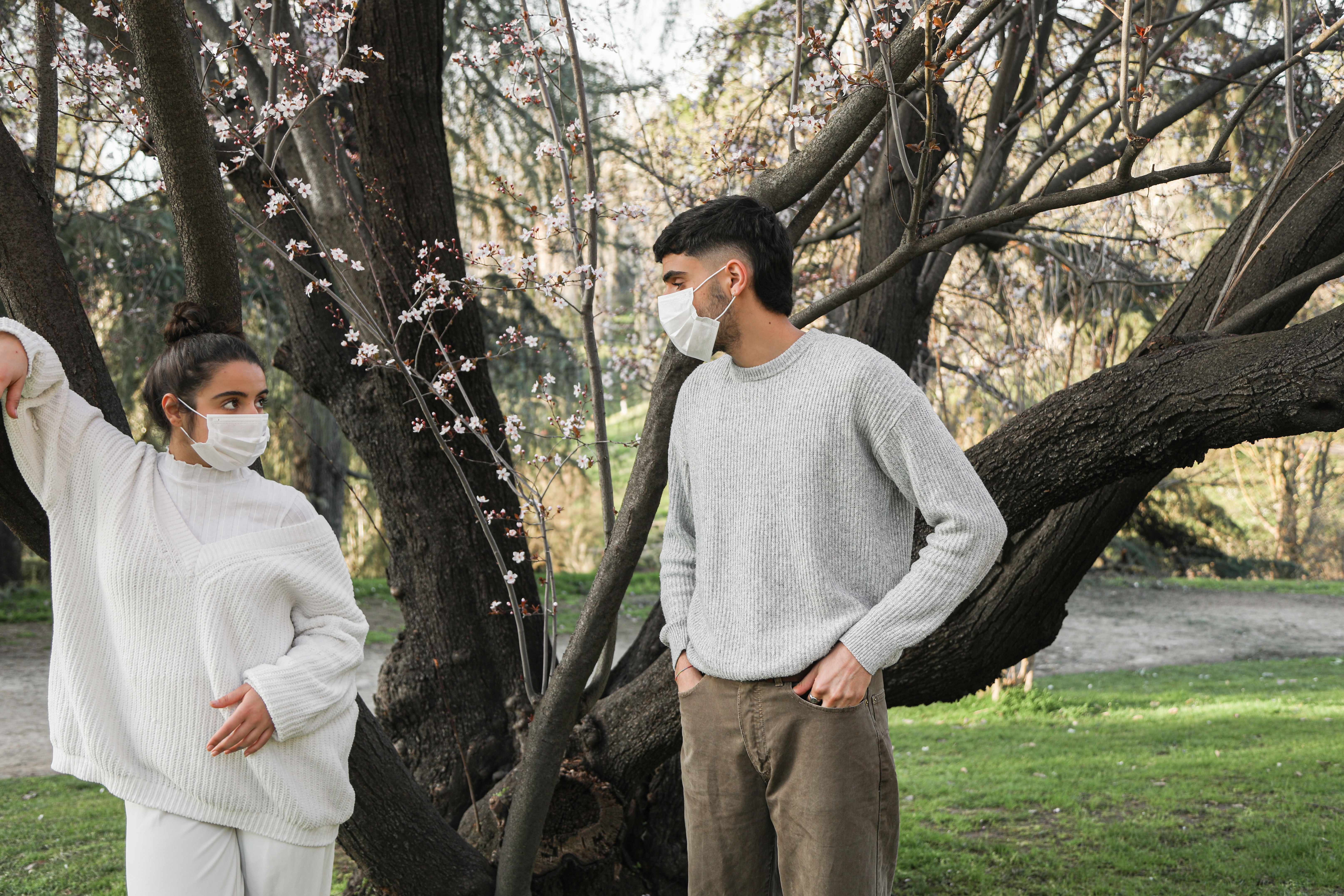 Man and Woman Standing Under a Tree · Free Stock Photo