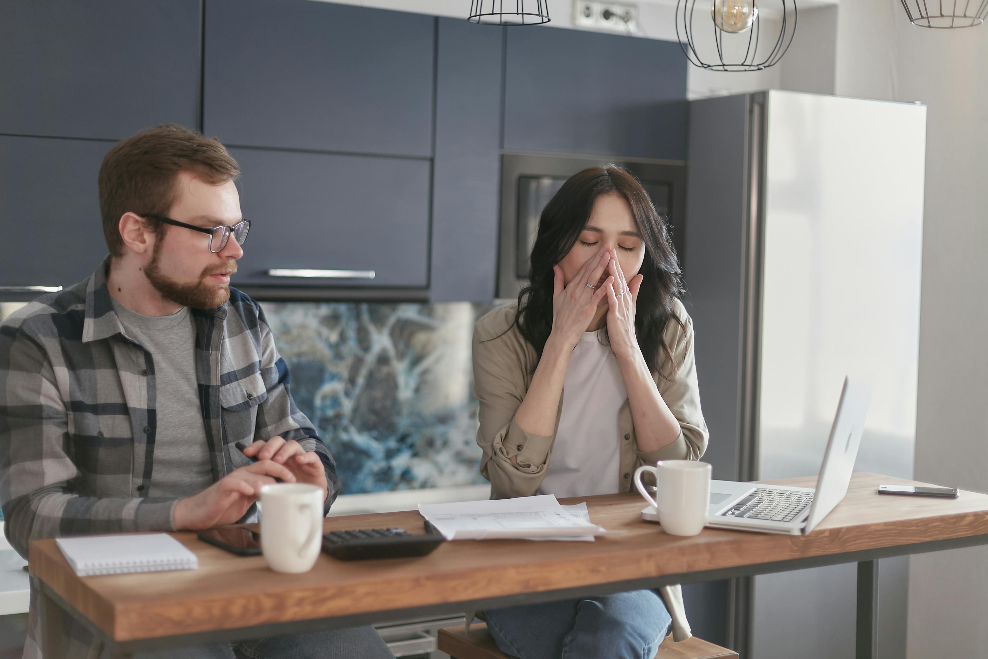 A Man and a Woman Working Hard in the Office · Free Stock Photo