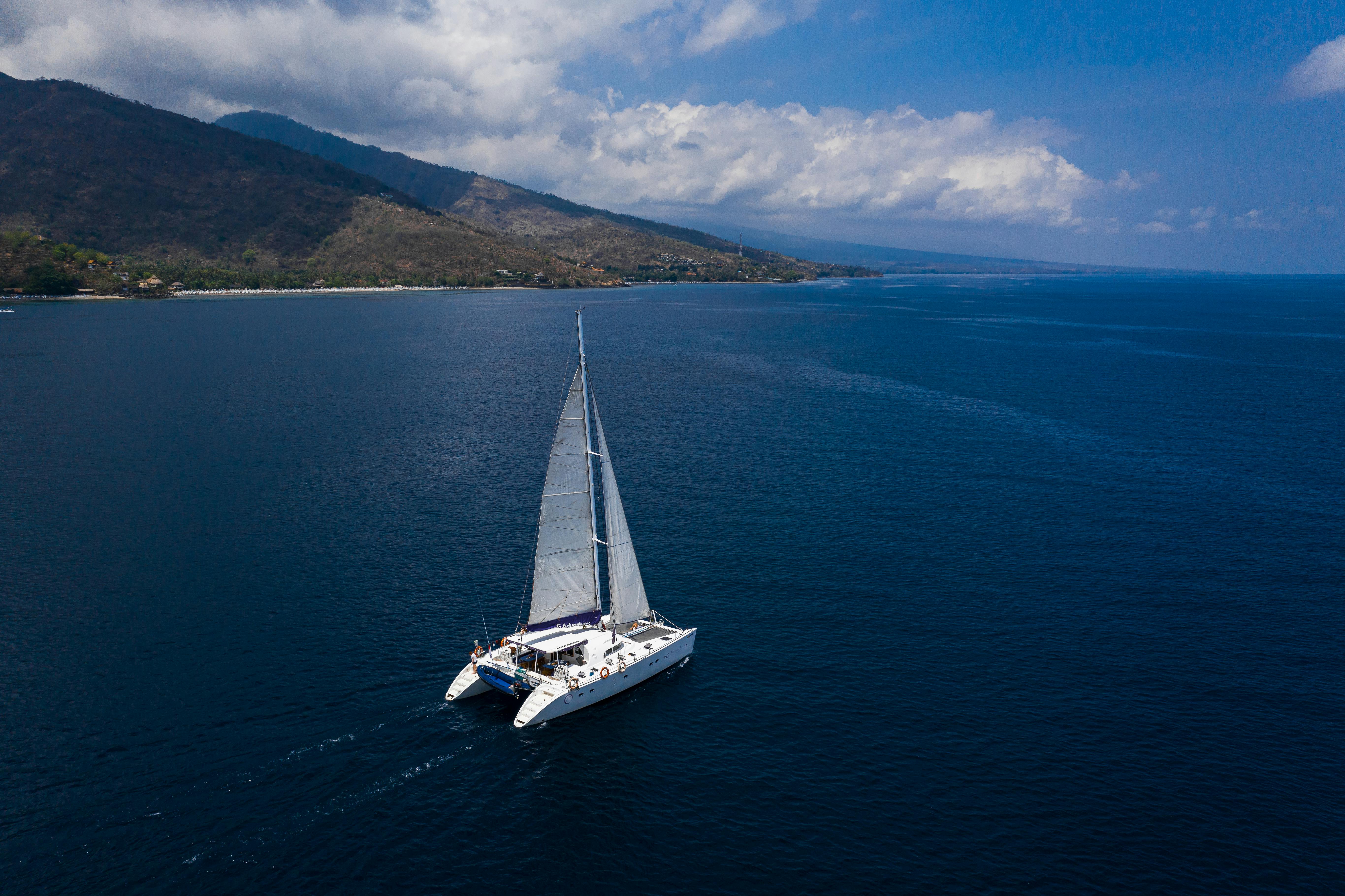 A Yacht Sailing in the Blue Ocean · Free Stock Photo