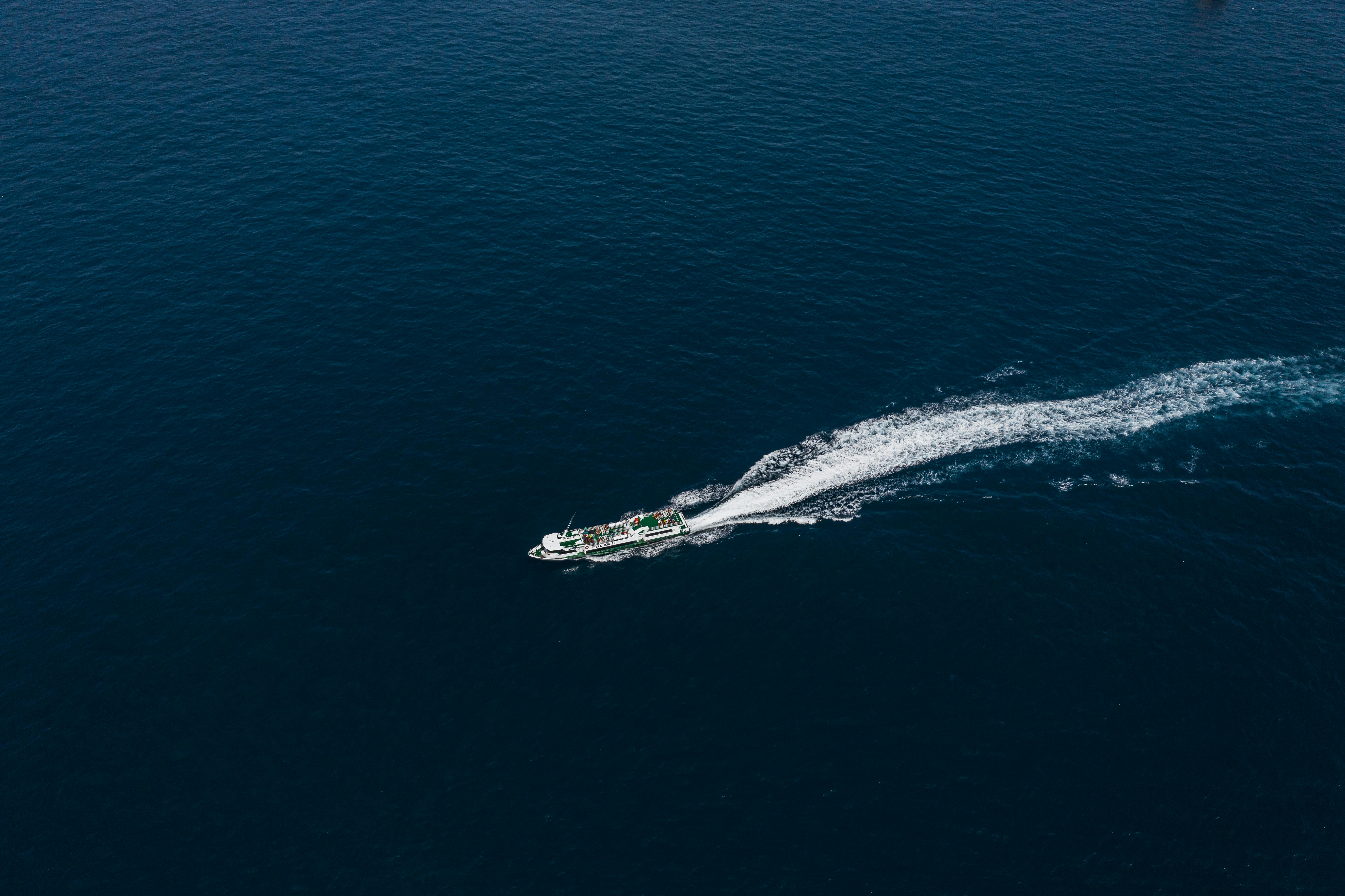 Birds Eye View of Boat on Body of Water · Free Stock Photo