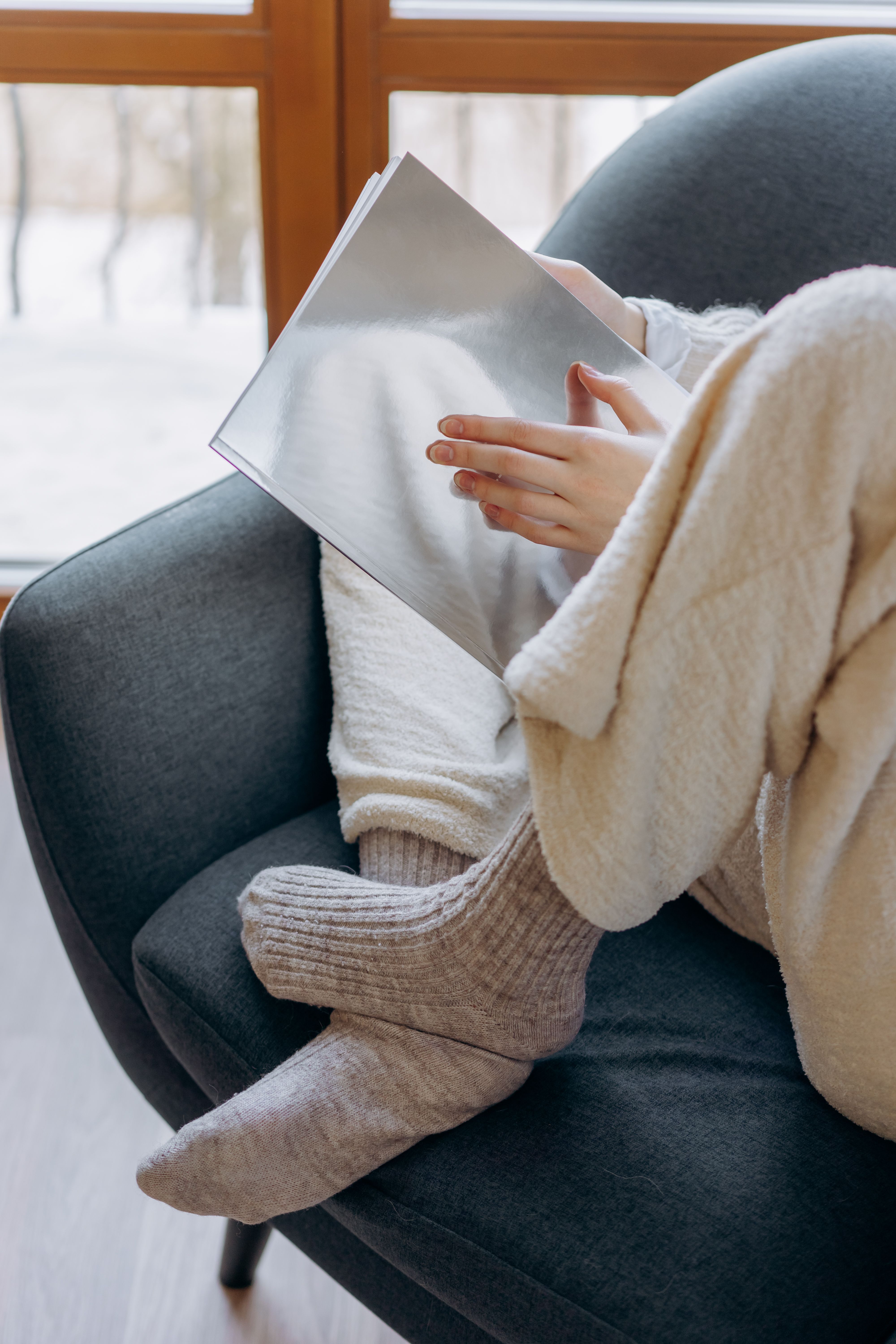 Person in White Pants Sitting on Gray Chair · Free Stock Photo