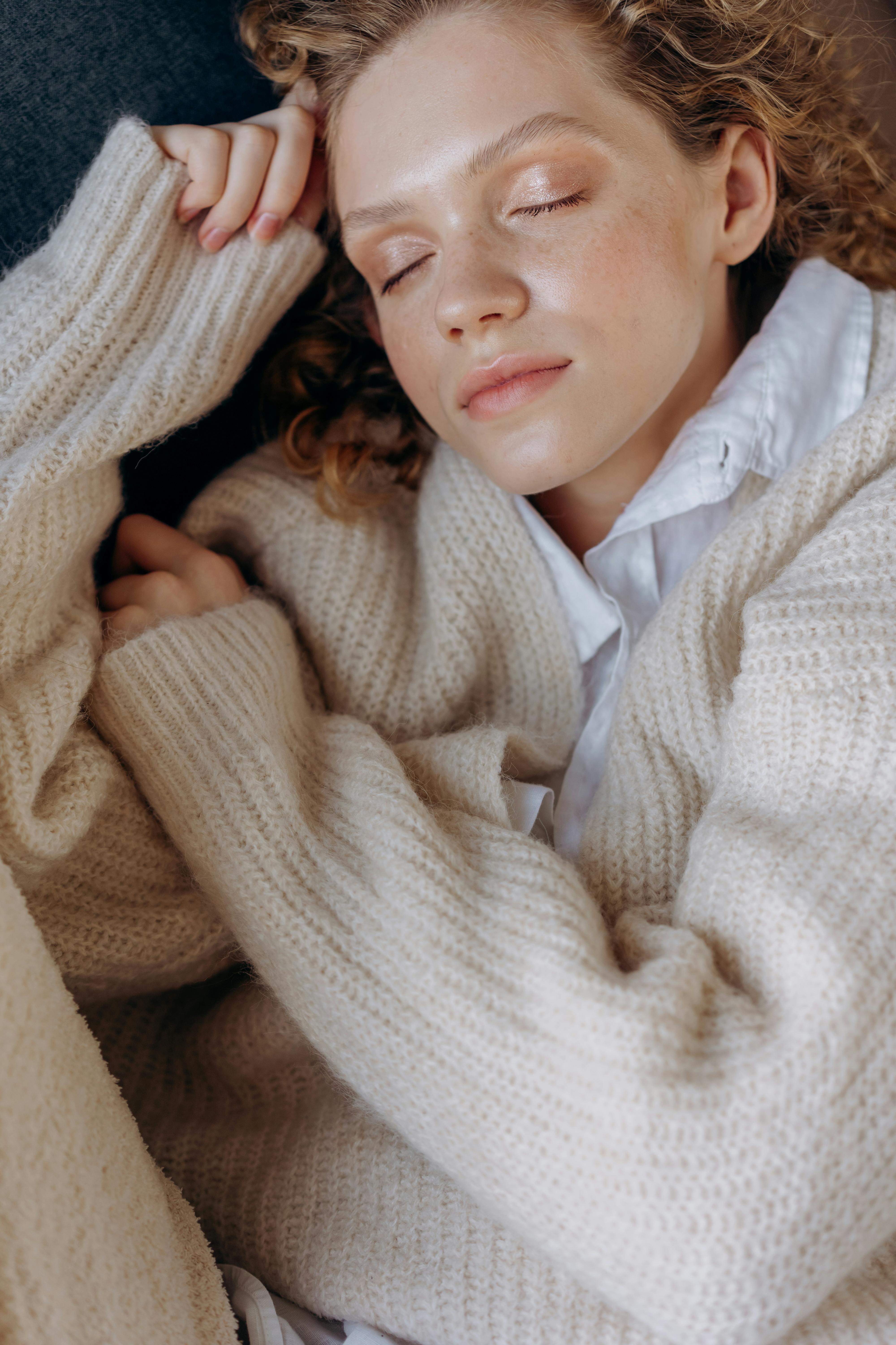 A Woman Wearing a Knitted Sweater Sleeping · Free Stock Photo
