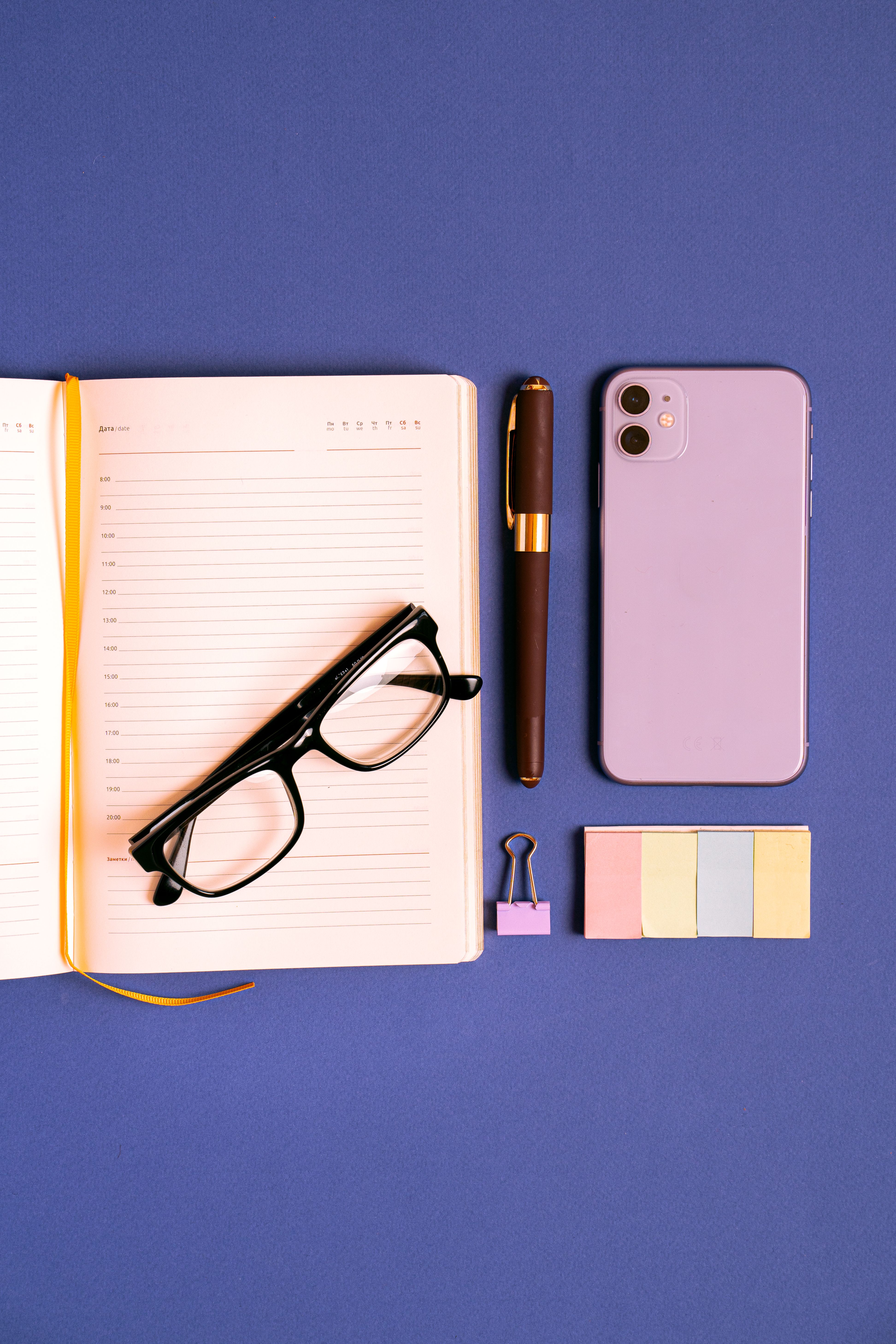 Gold Colored Paper Clips Near Notebook And Pen On White Surface · Free ...