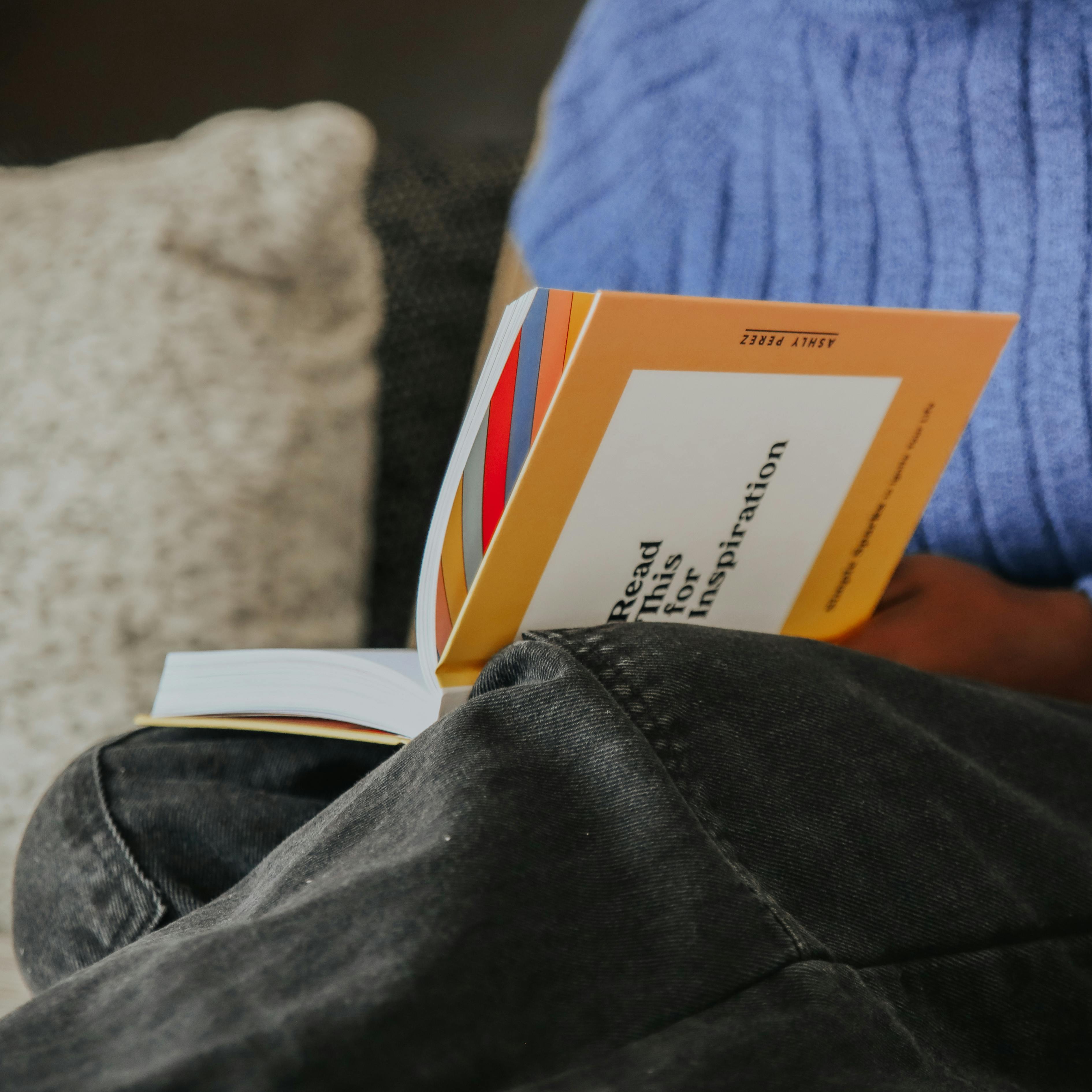 Close-Up Shot of a Person Reading a Book · Free Stock Photo