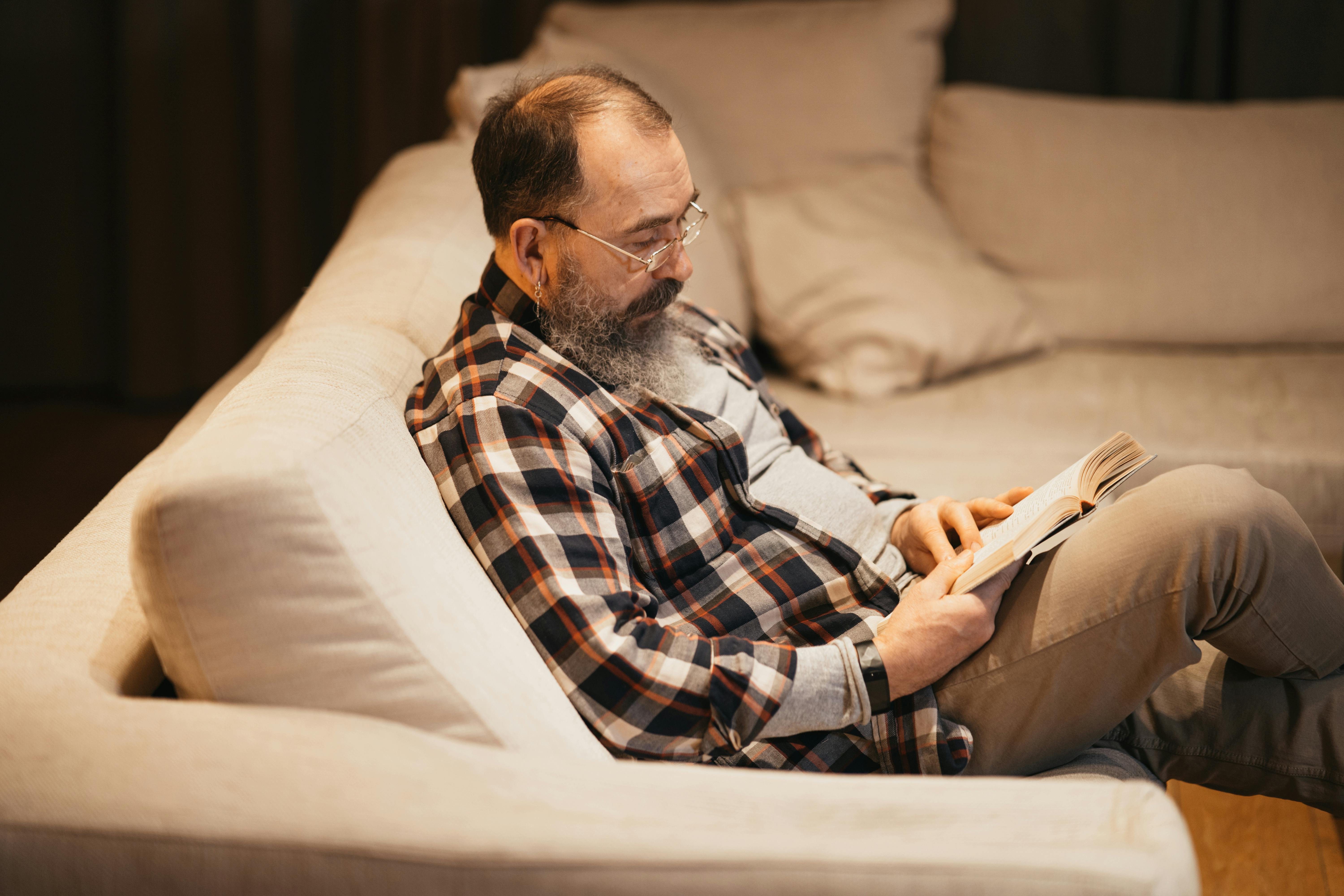 A Man Sitting on the Couch · Free Stock Photo