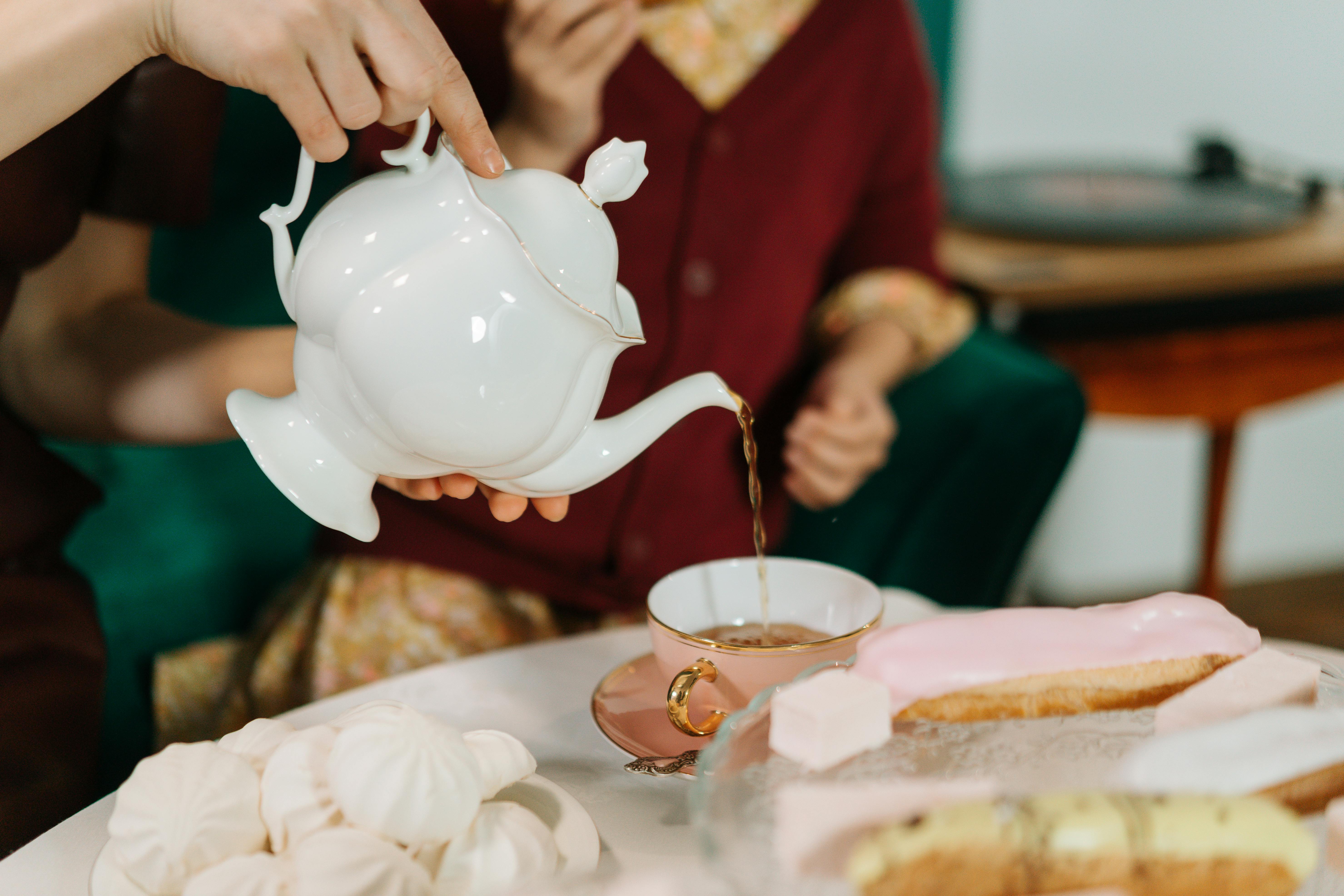 A Man Holding a Teapot · Free Stock Photo