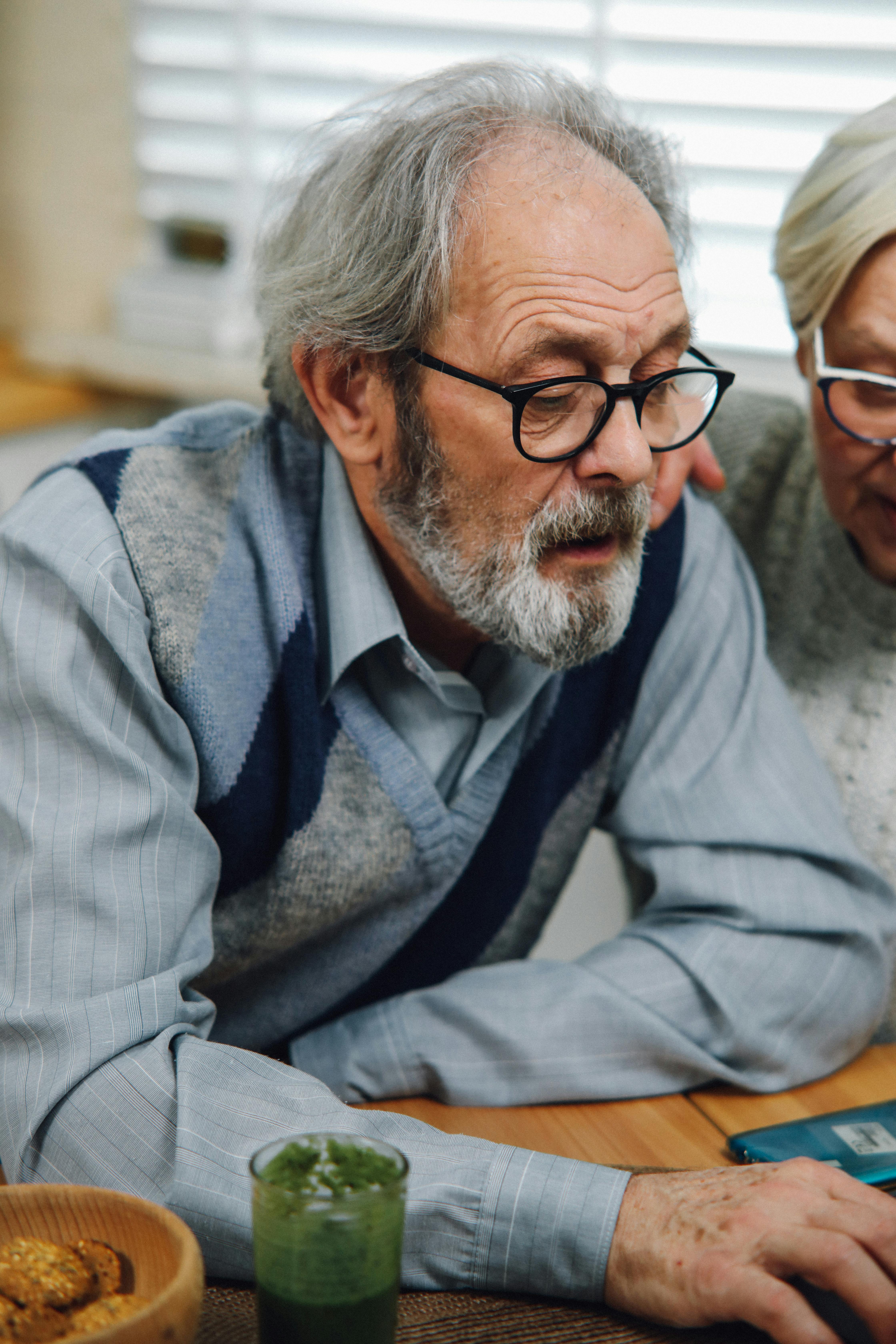 Man Sitting by Table · Free Stock Photo