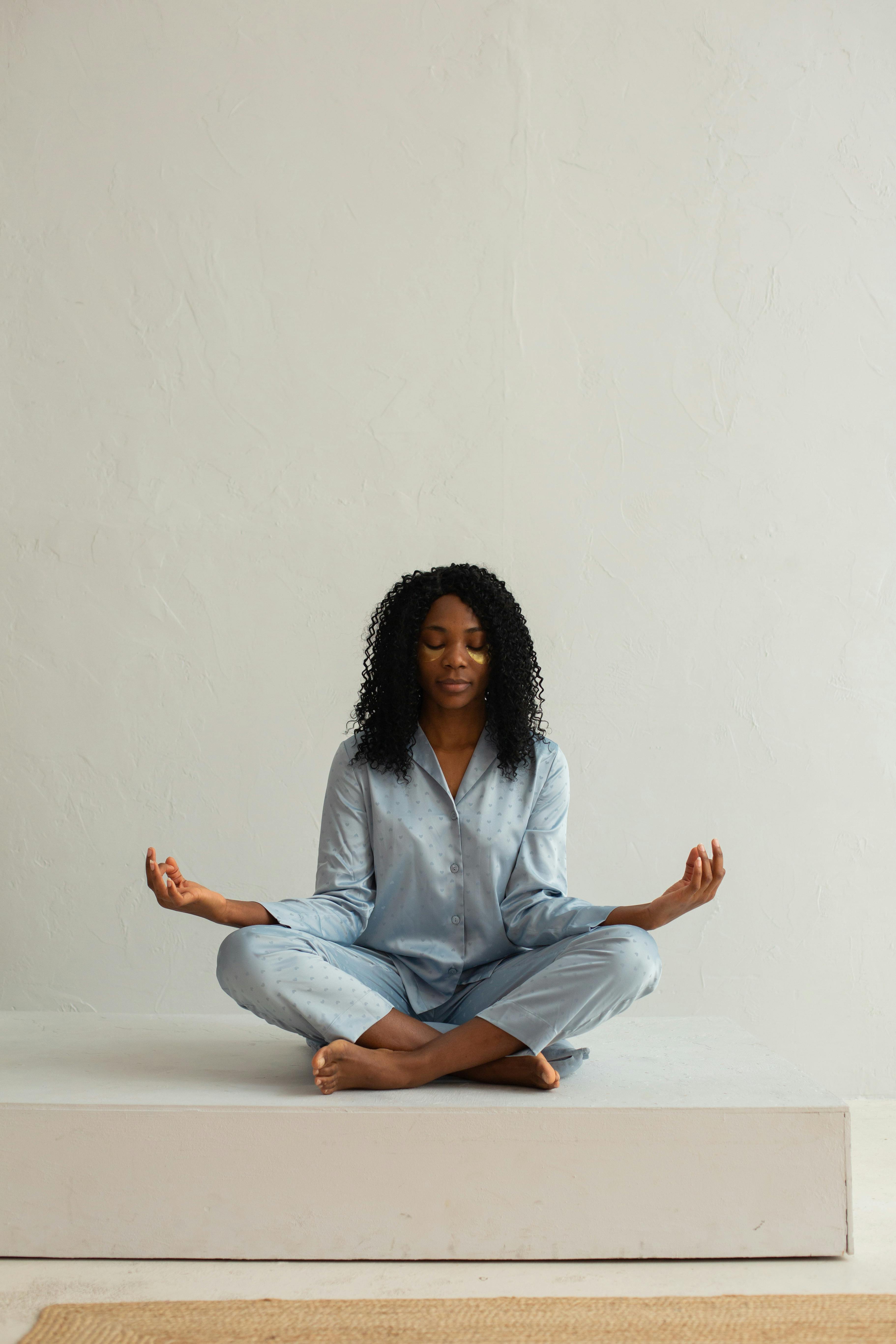 Woman Sitting and Meditating · Free Stock Photo