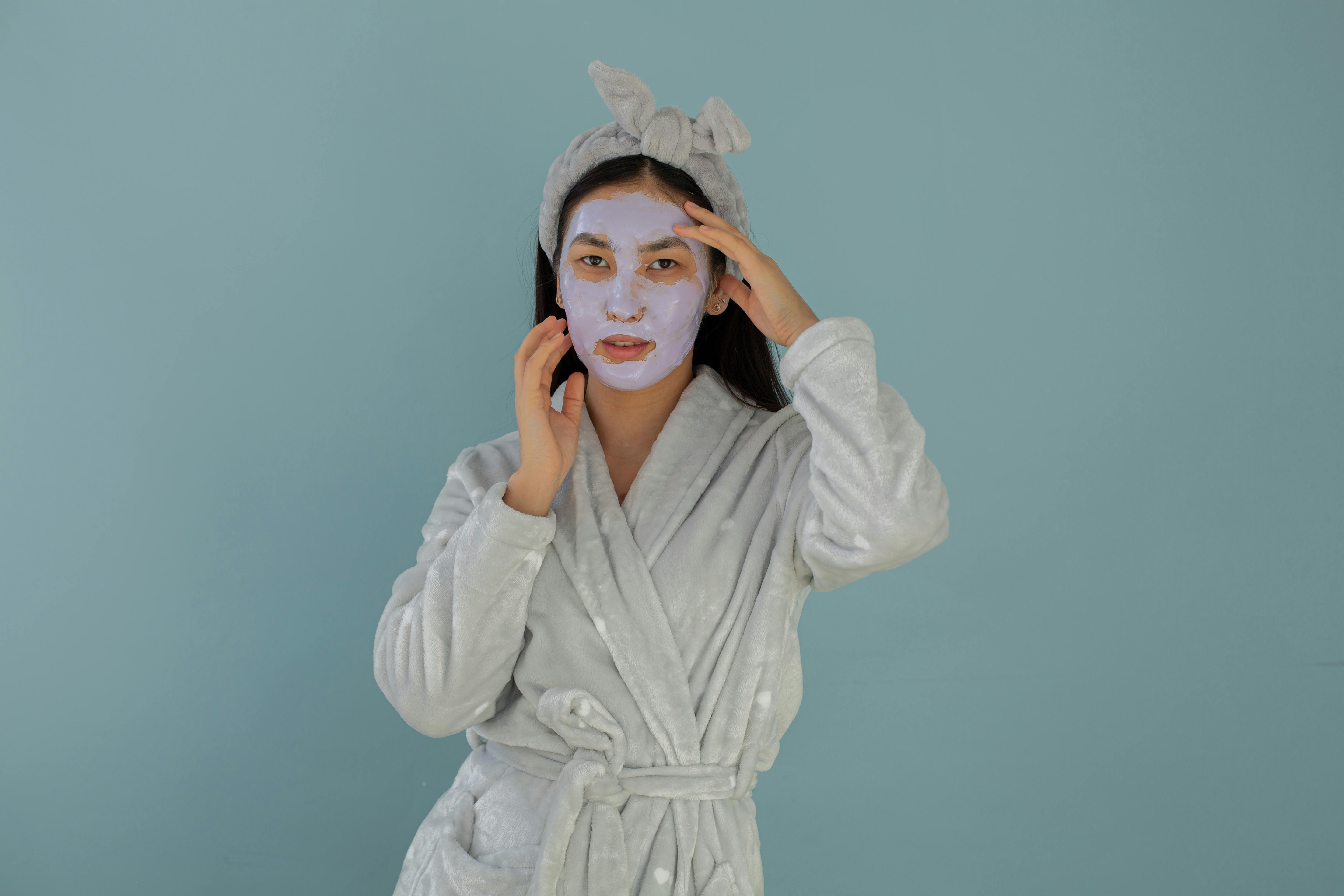 Content Indian woman touching cheeks with delicate skin · Free Stock Photo