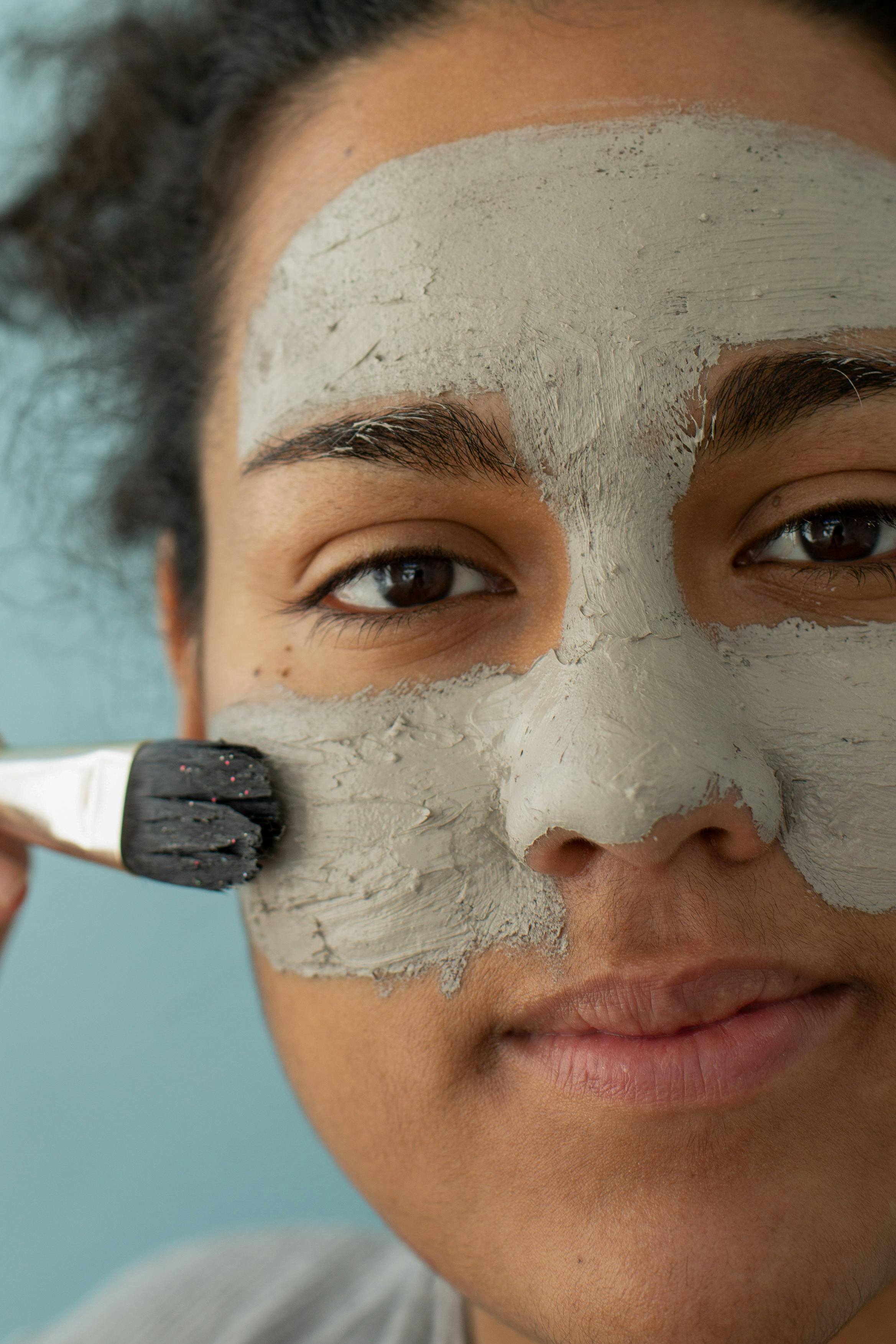 Anonymous black woman with clay mask · Free Stock Photo