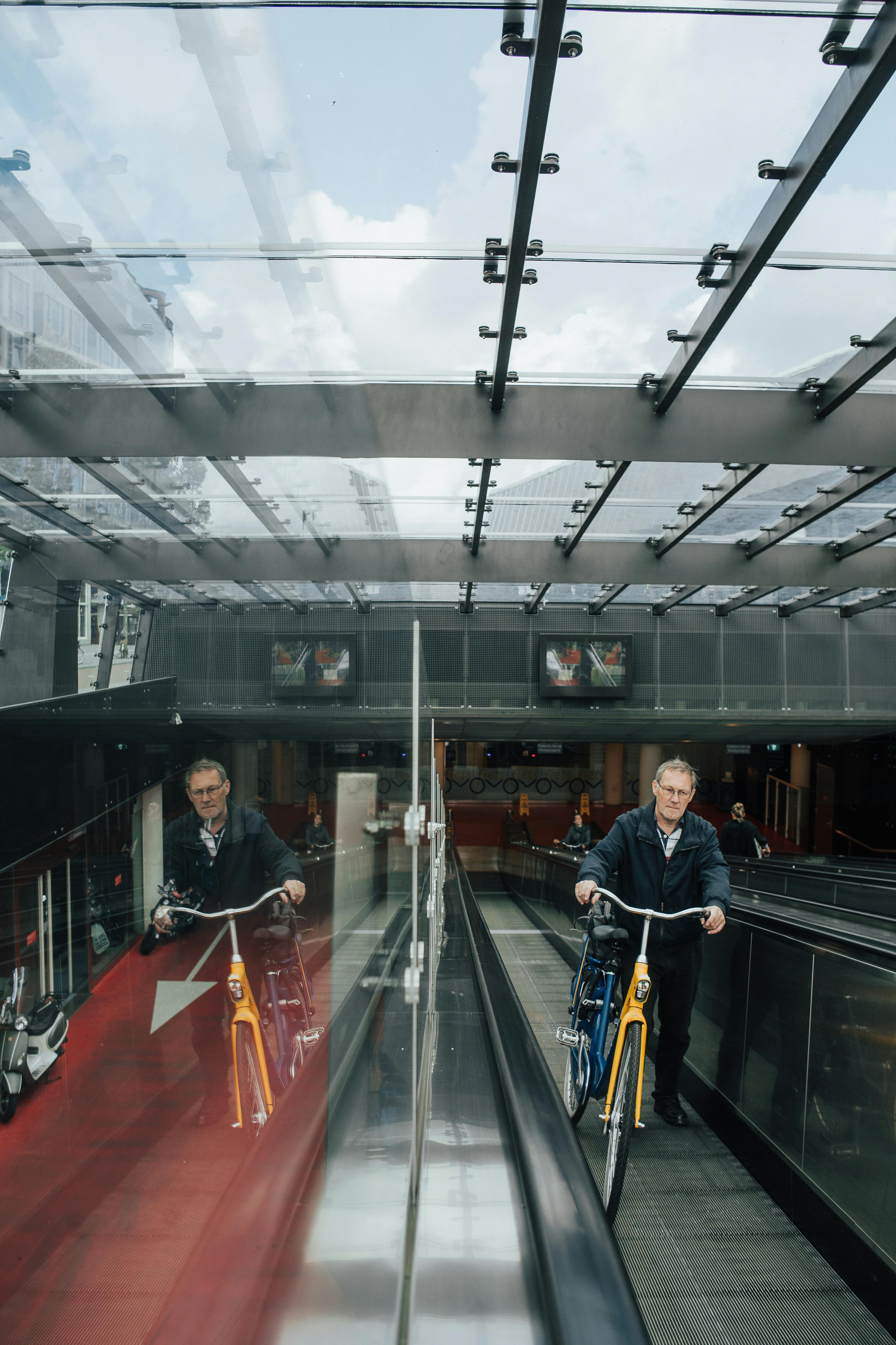 A Man Walking on a Walkalator · Free Stock Photo