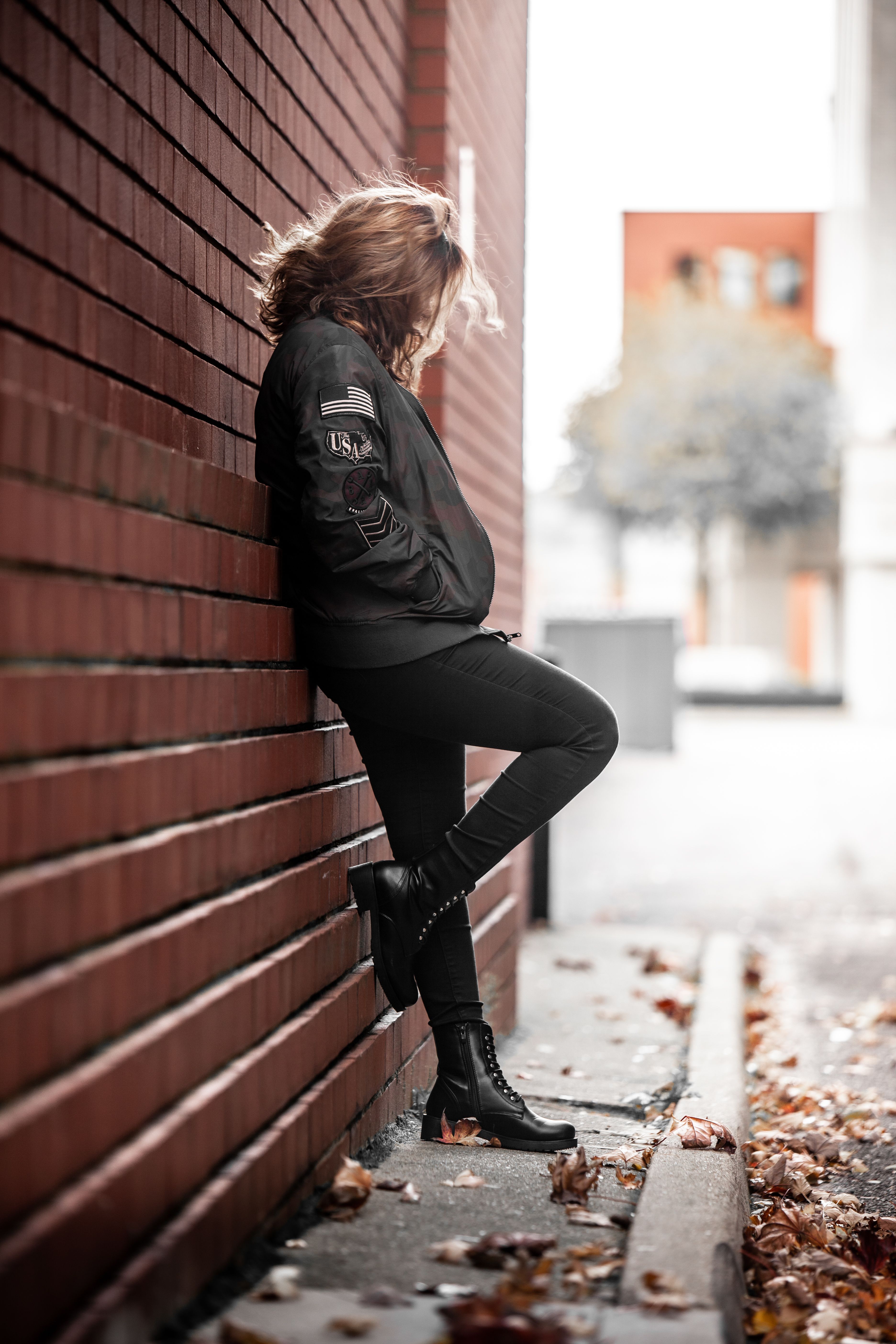 Woman Standing by the Wall · Free Stock Photo