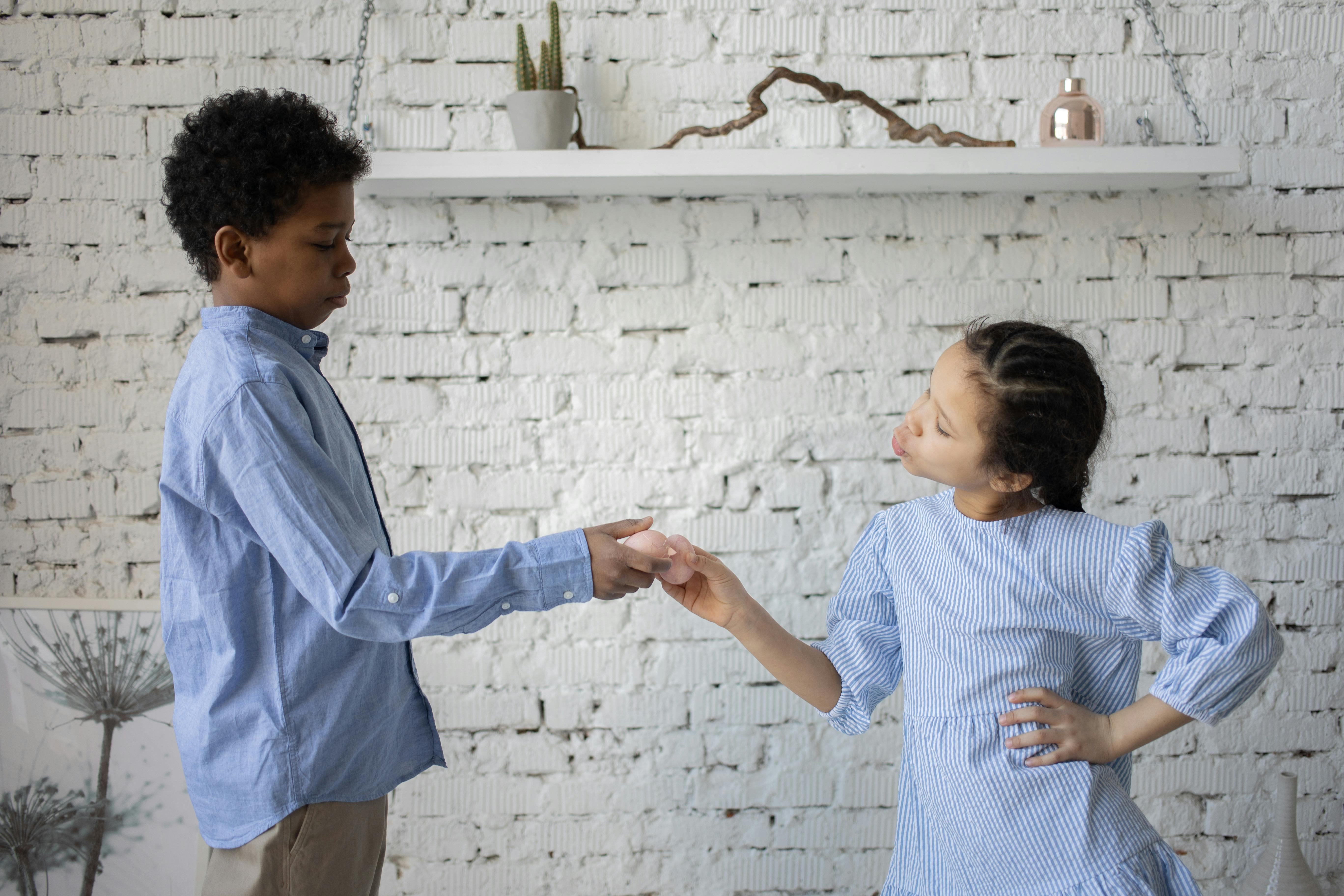 Boy Standing Beside Girl Outdoors · Free Stock Photo