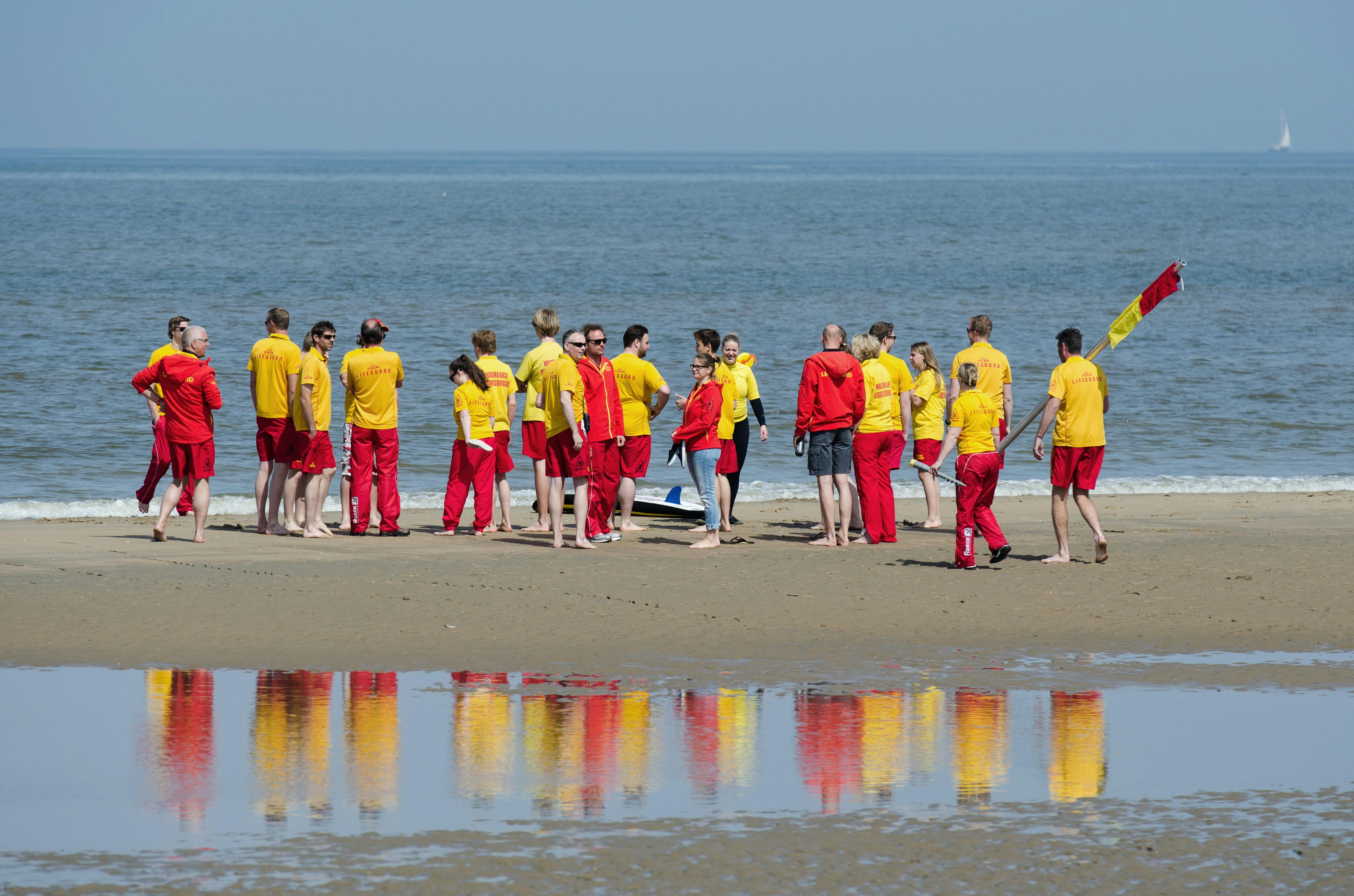 Group of Lifeguards on Beach · Free Stock Photo