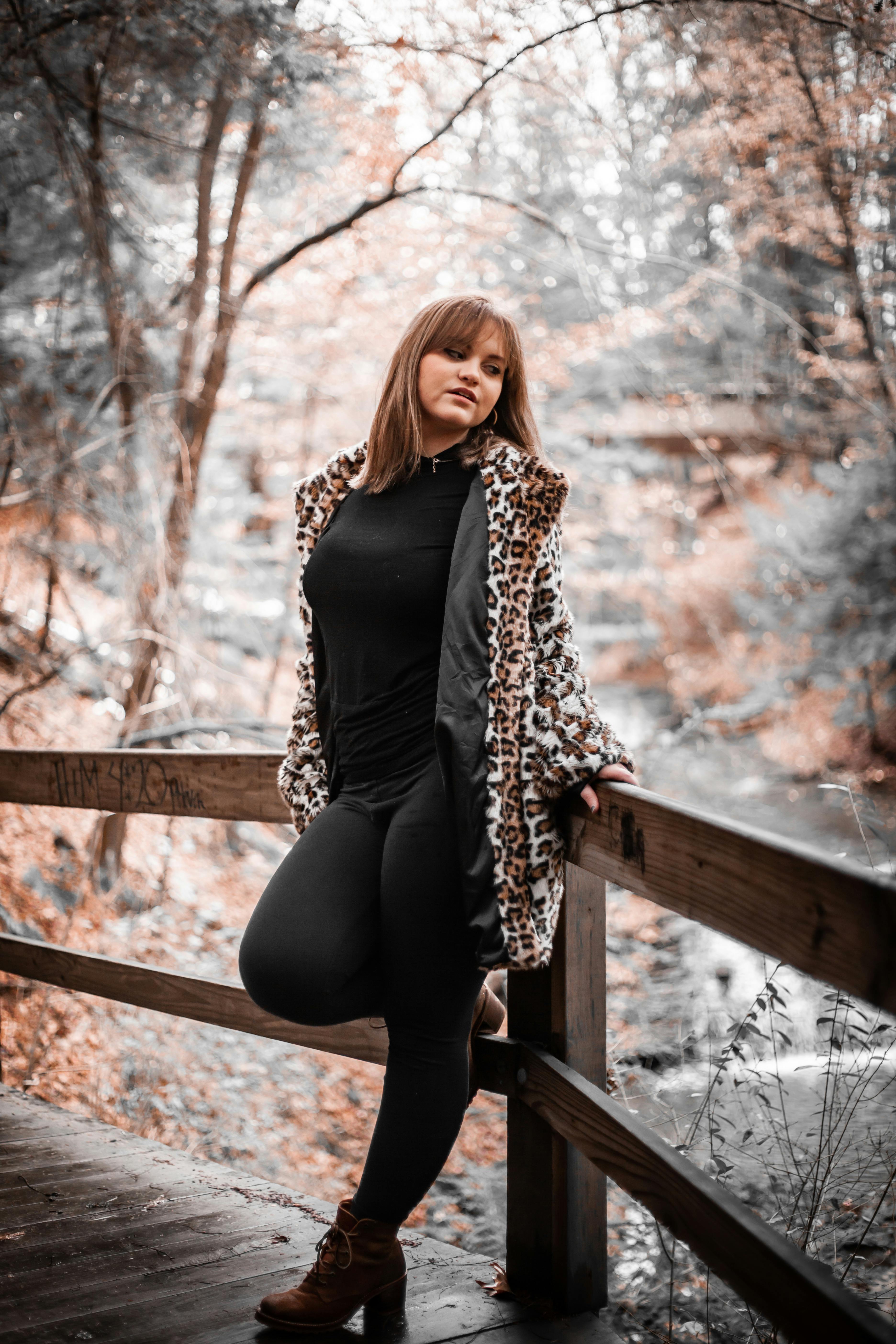 Photo of Woman Leaning on Railing · Free Stock Photo
