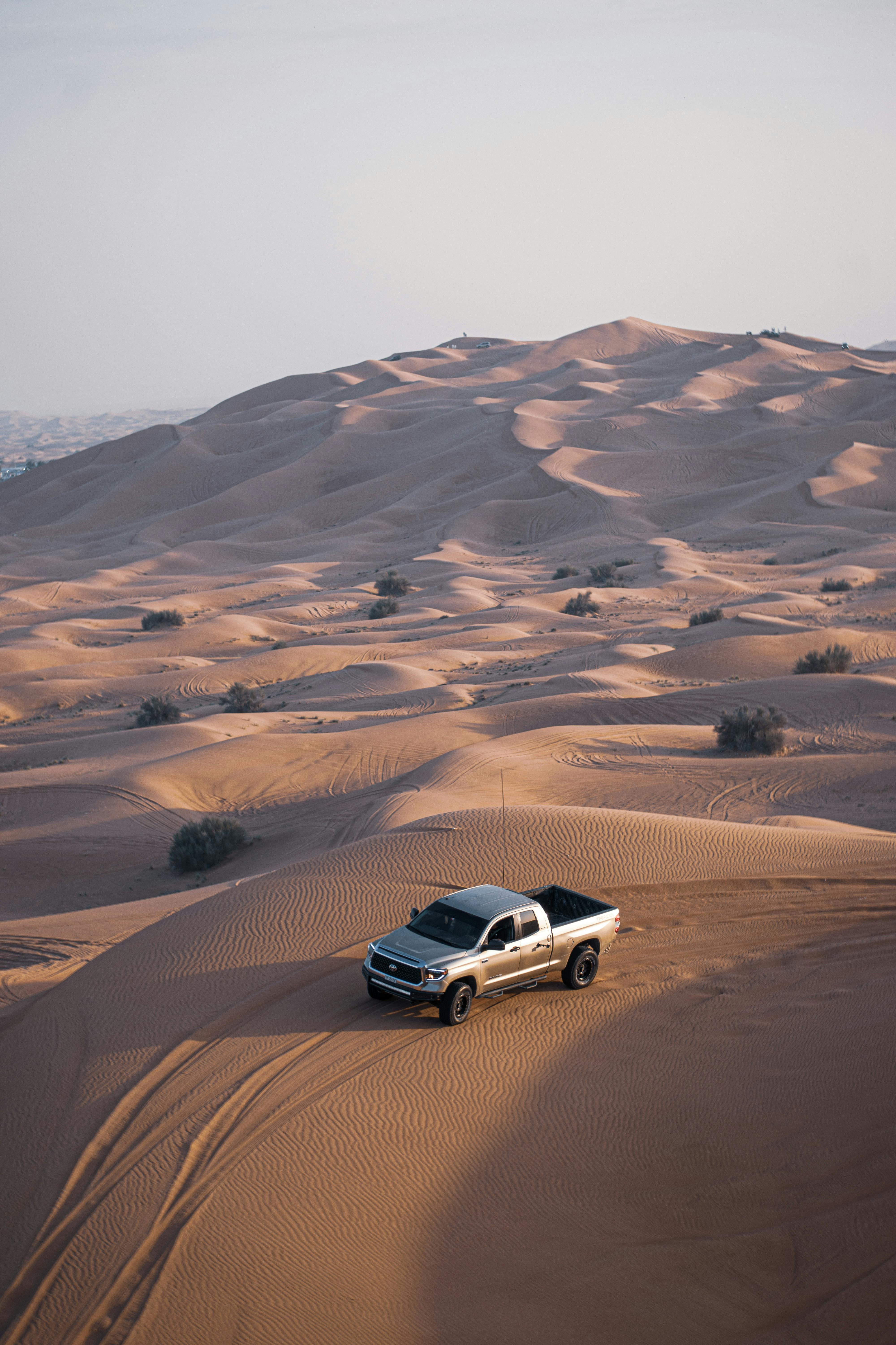 Vehicle Parked on the Desert · Free Stock Photo