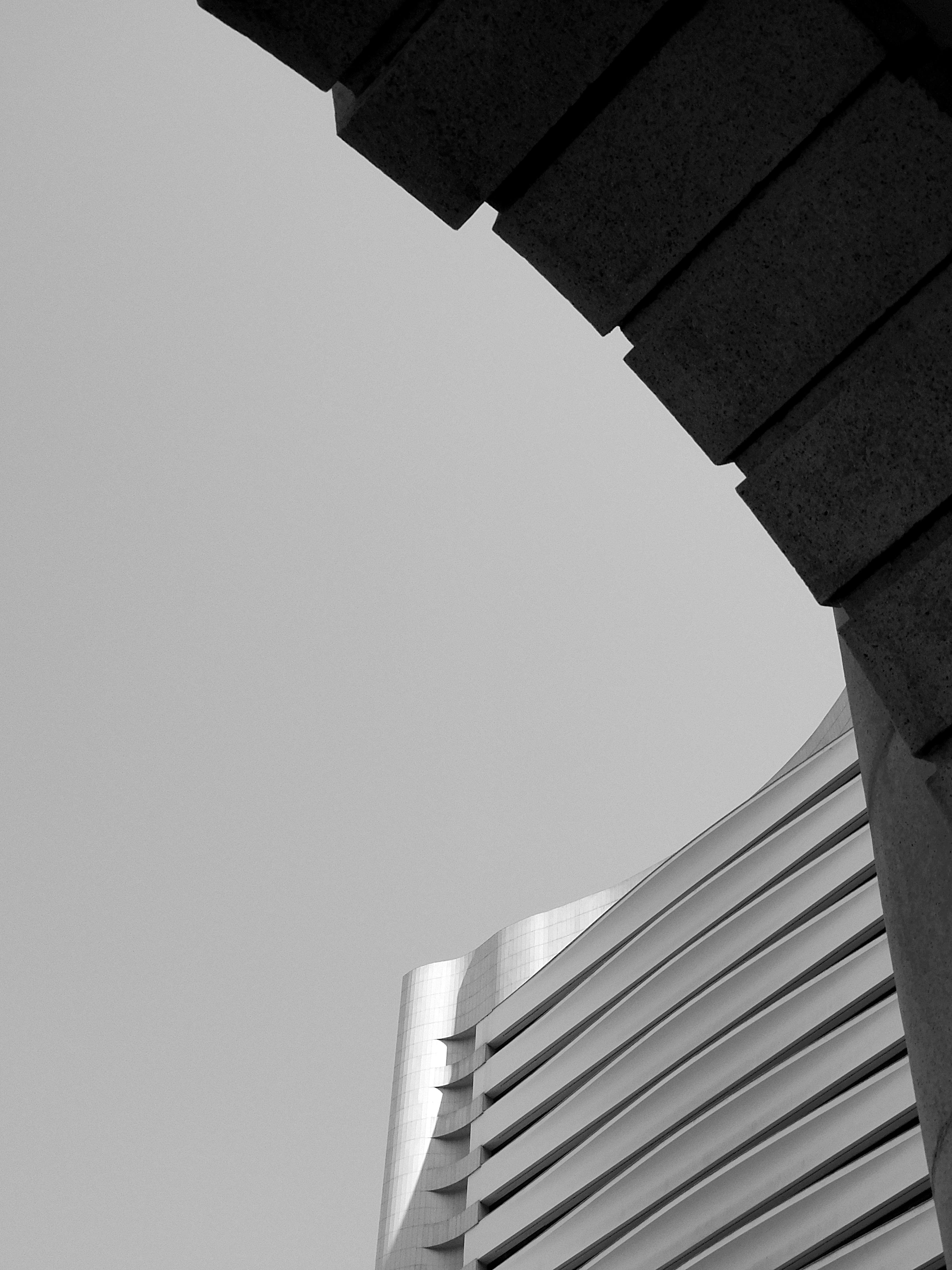 Facade of modern unusual geometric building in city · Free Stock Photo