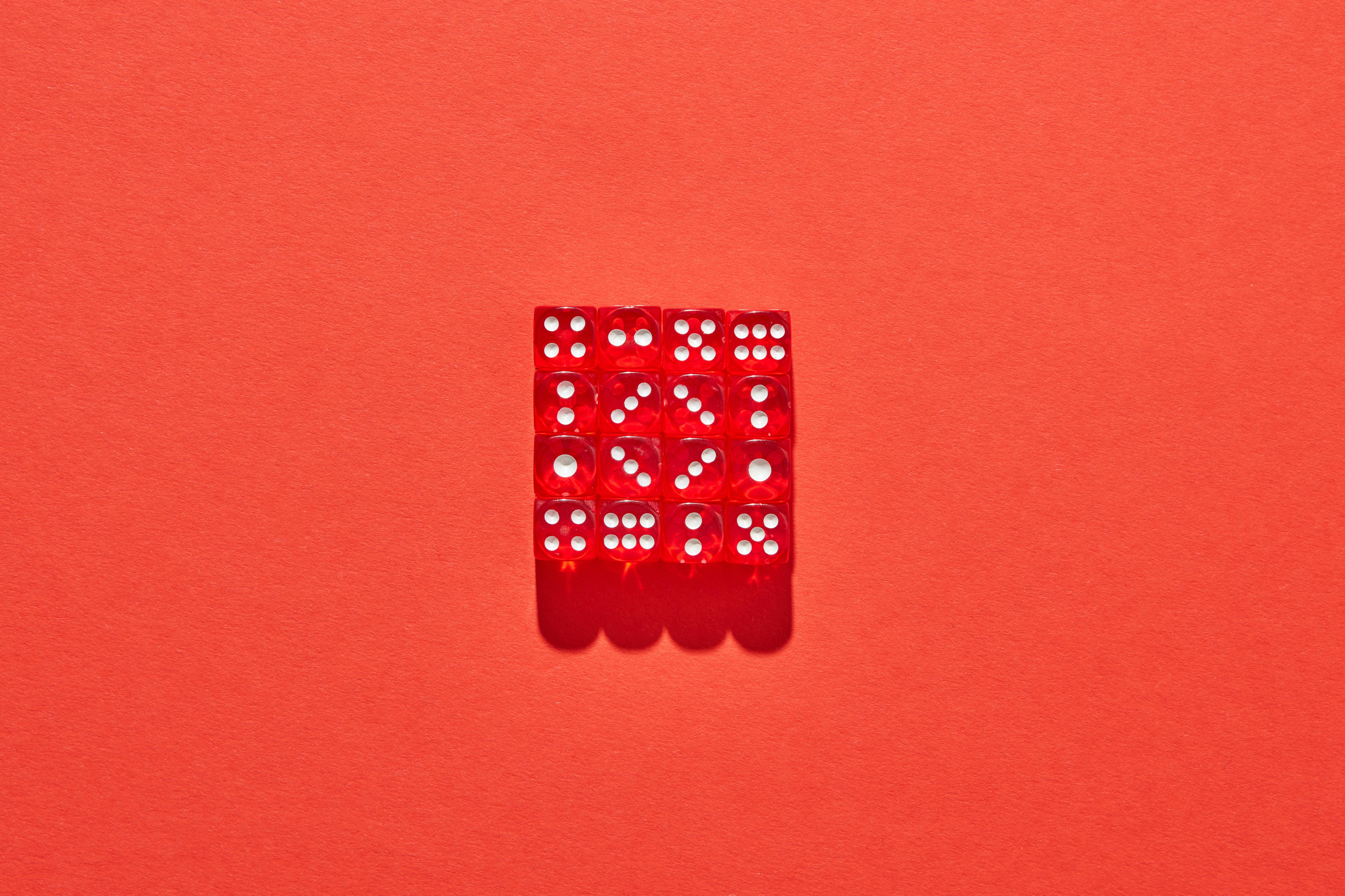 Cube with Dots on Red Surface · Free Stock Photo