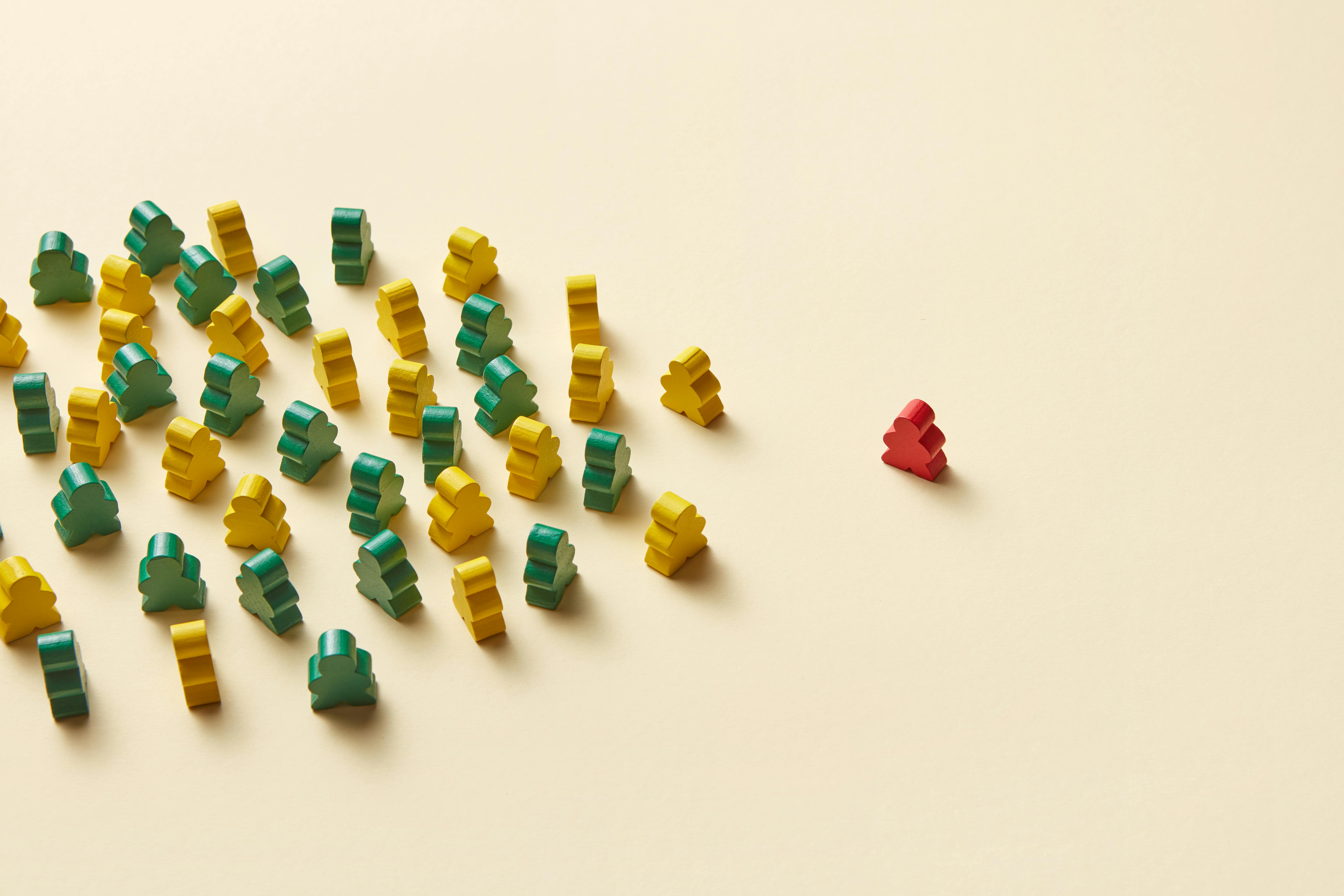 Single Red Pawn among Colorful Pawns · Free Stock Photo