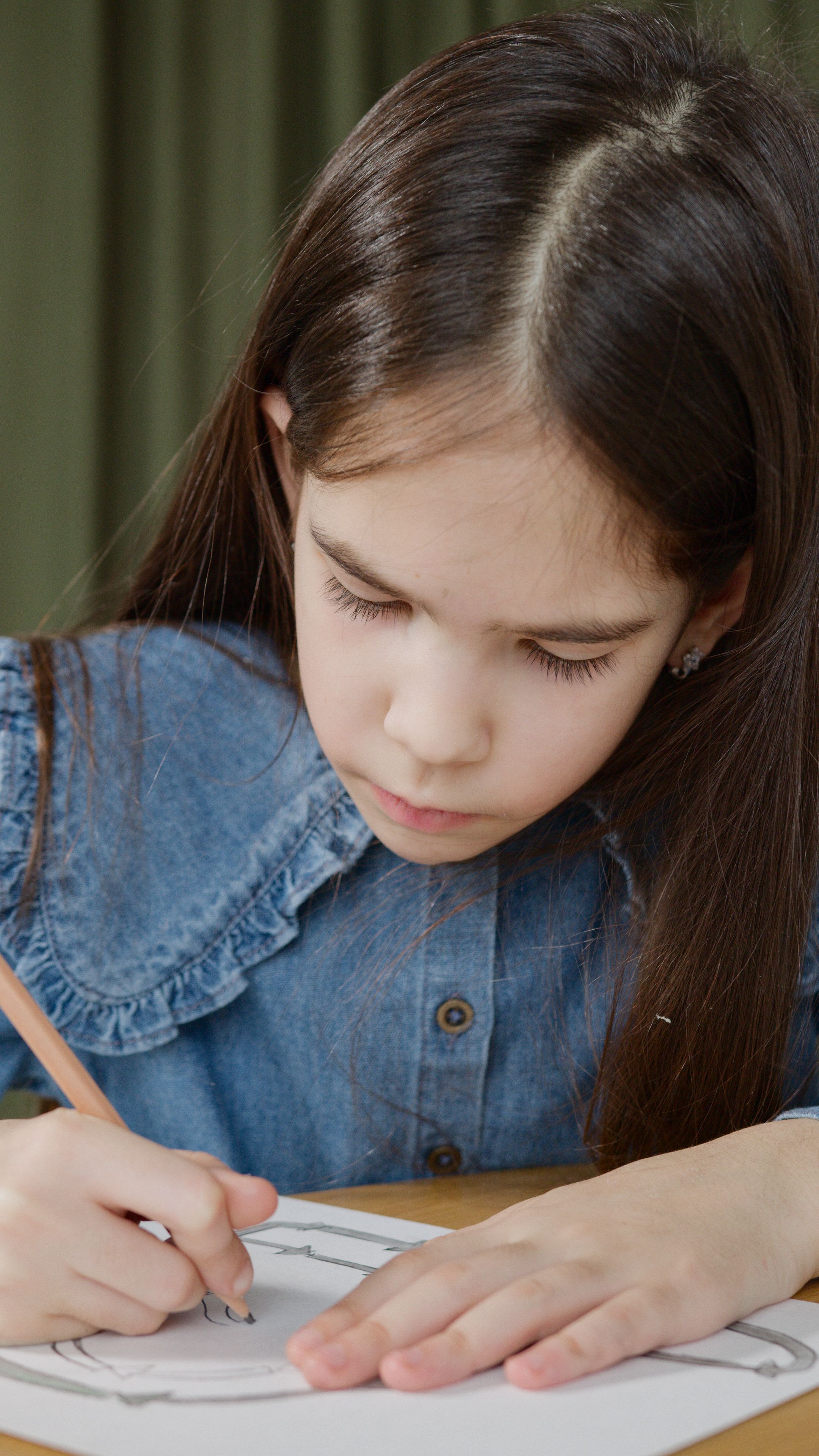 Kid Writing on a Paper · Free Stock Photo