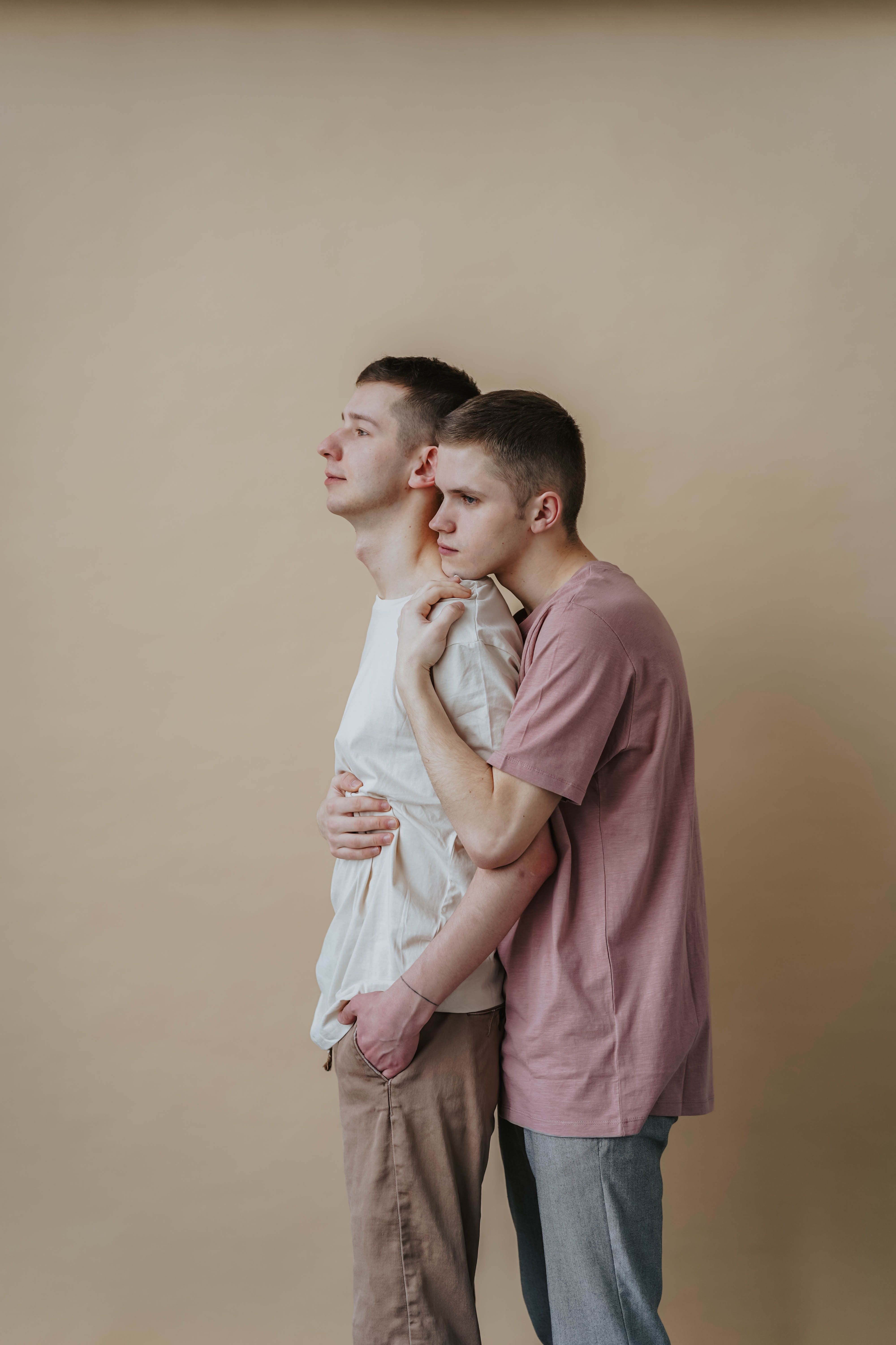 Man Hugging Another Man from Behind · Free Stock Photo