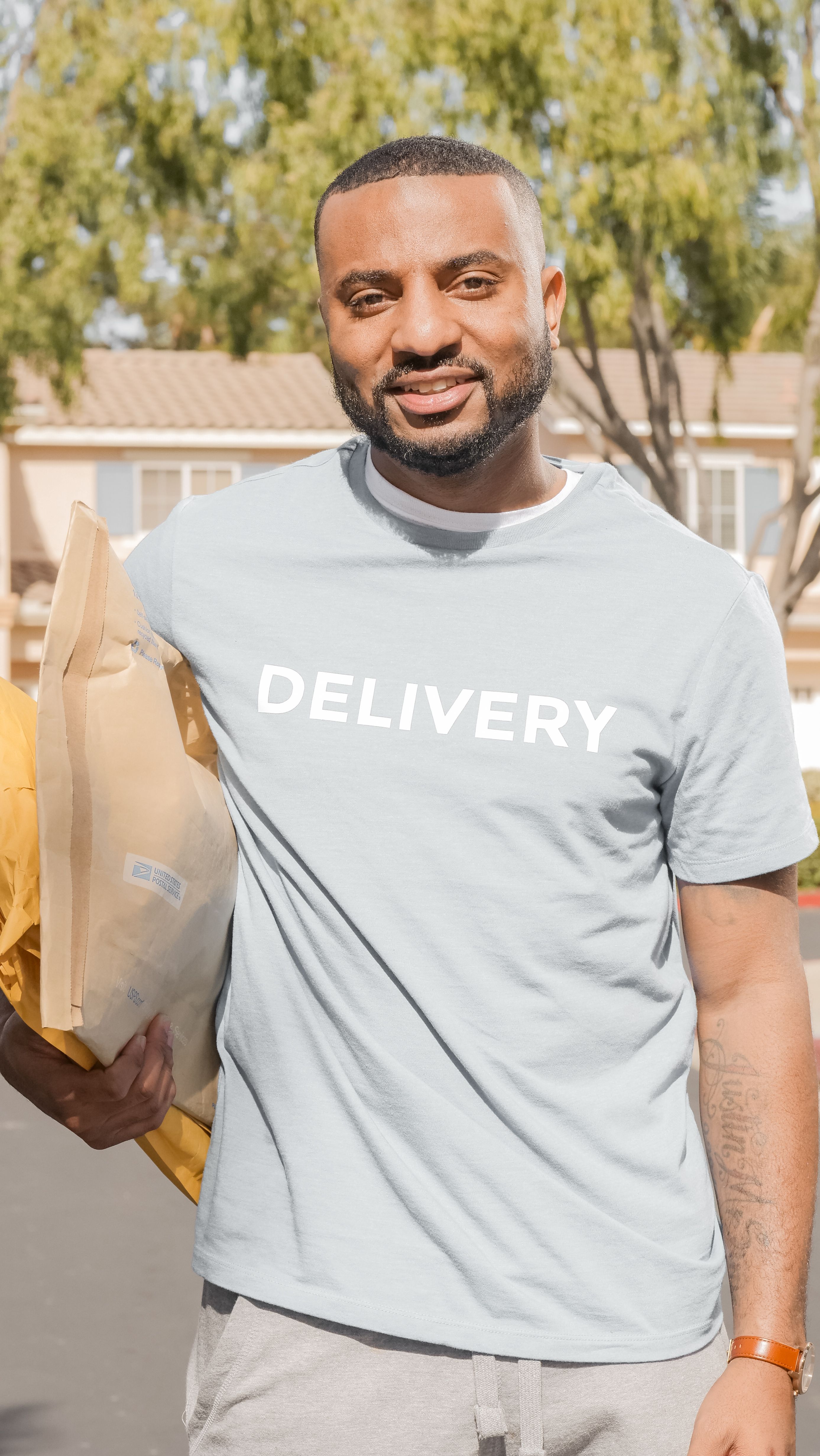A Man Handing a Package · Free Stock Photo