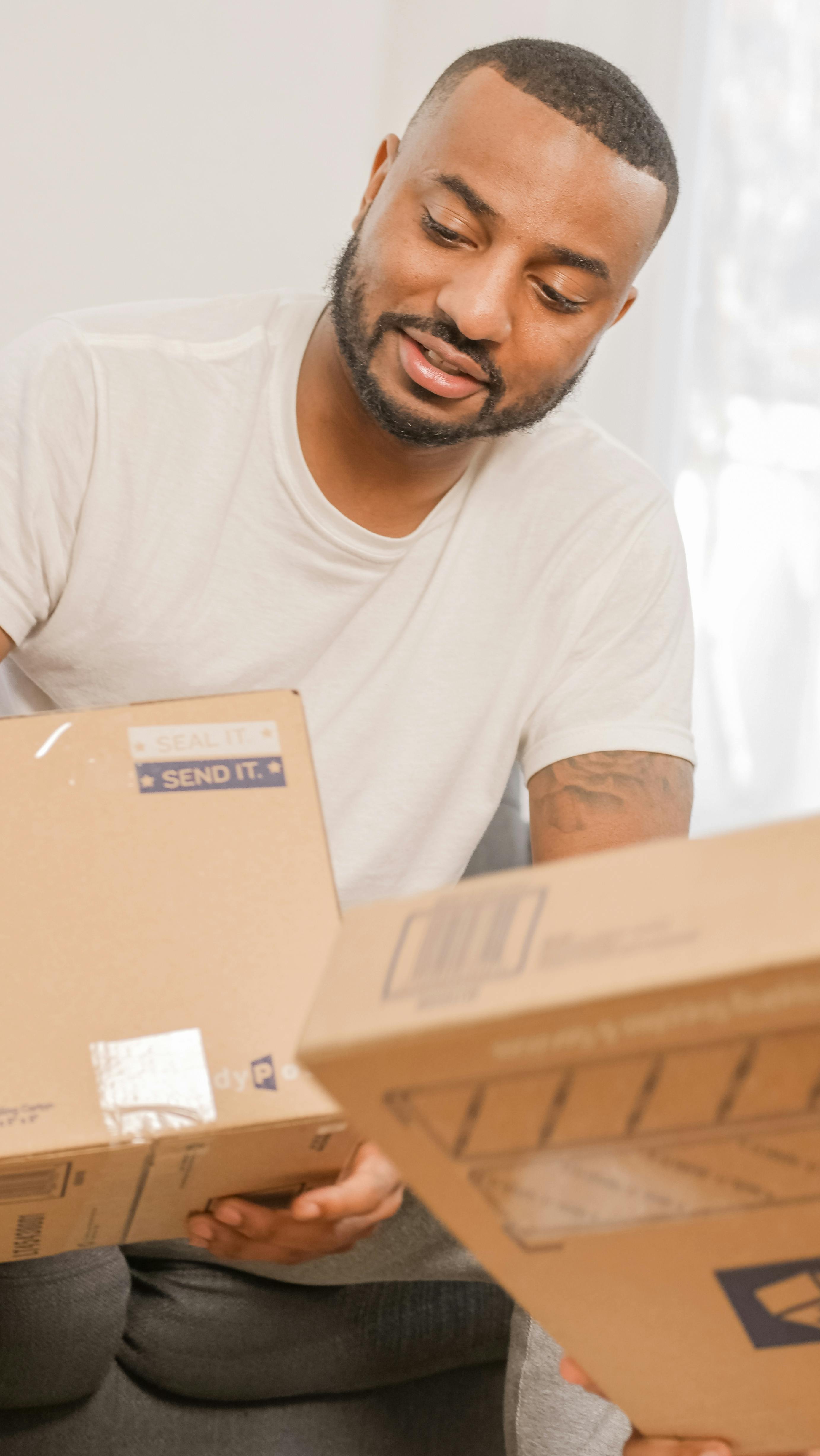 A Man Receiving a Package · Free Stock Photo