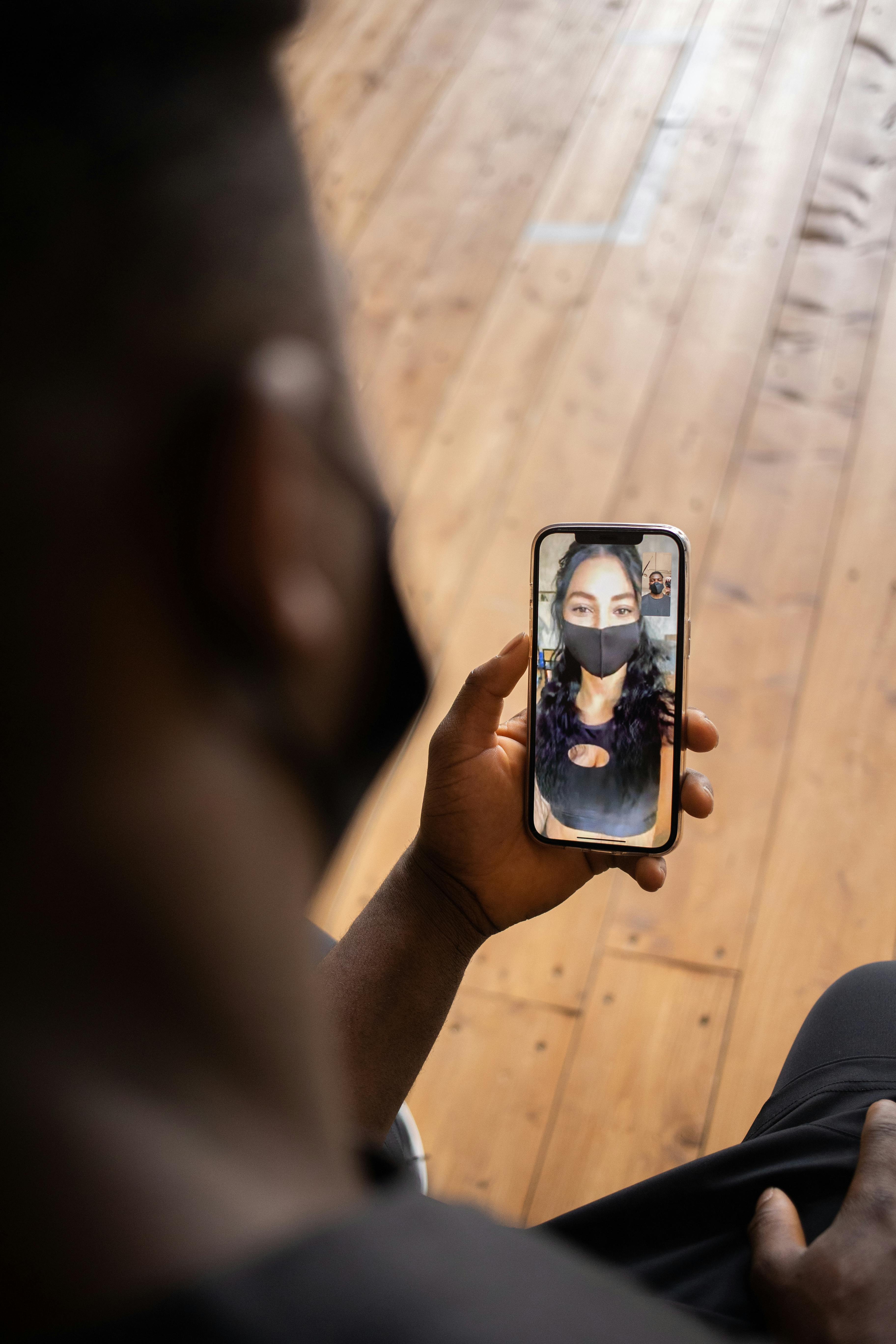 Man Facetiming with a Woman · Free Stock Photo