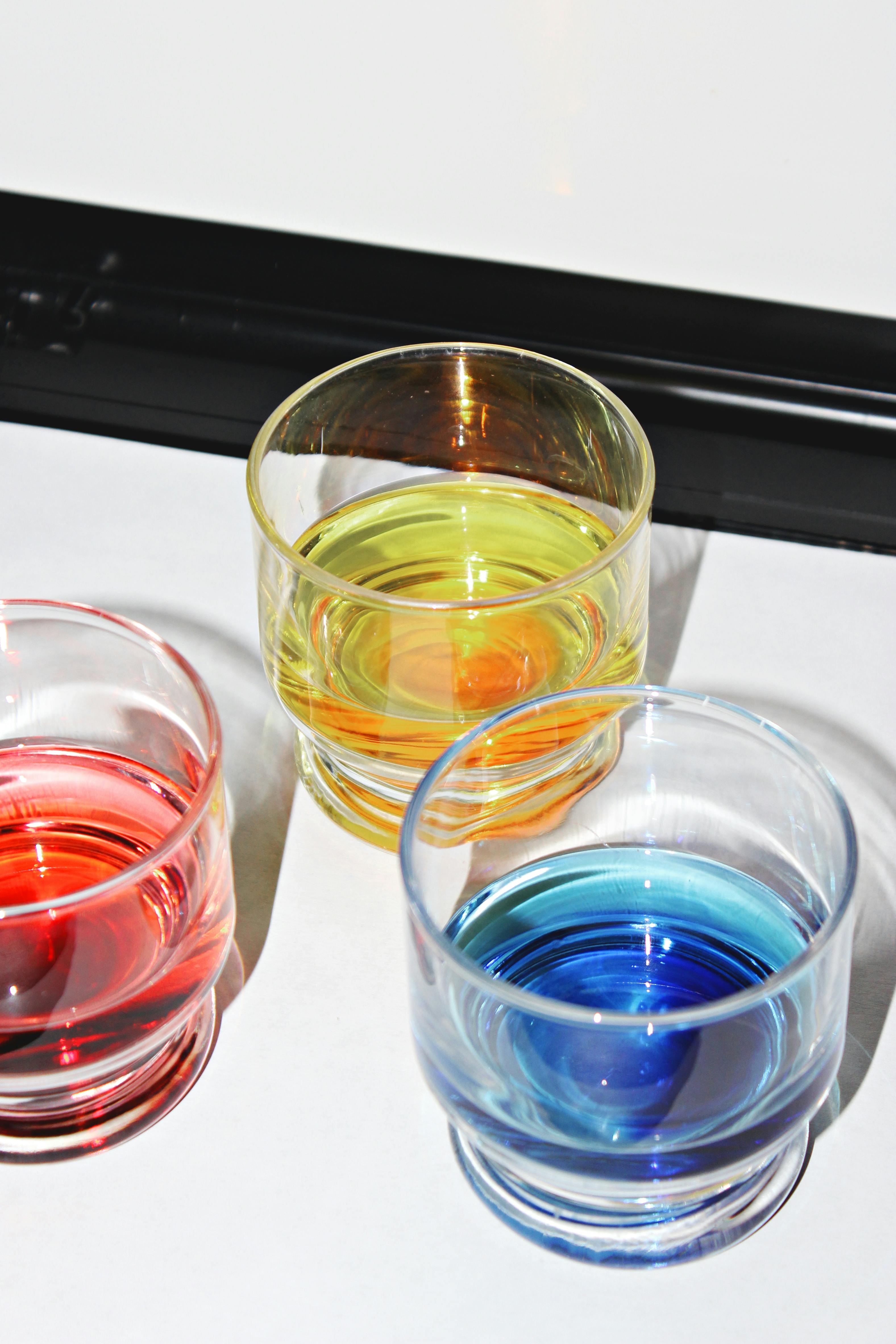 Colored Liquids on Glass Cups · Free Stock Photo