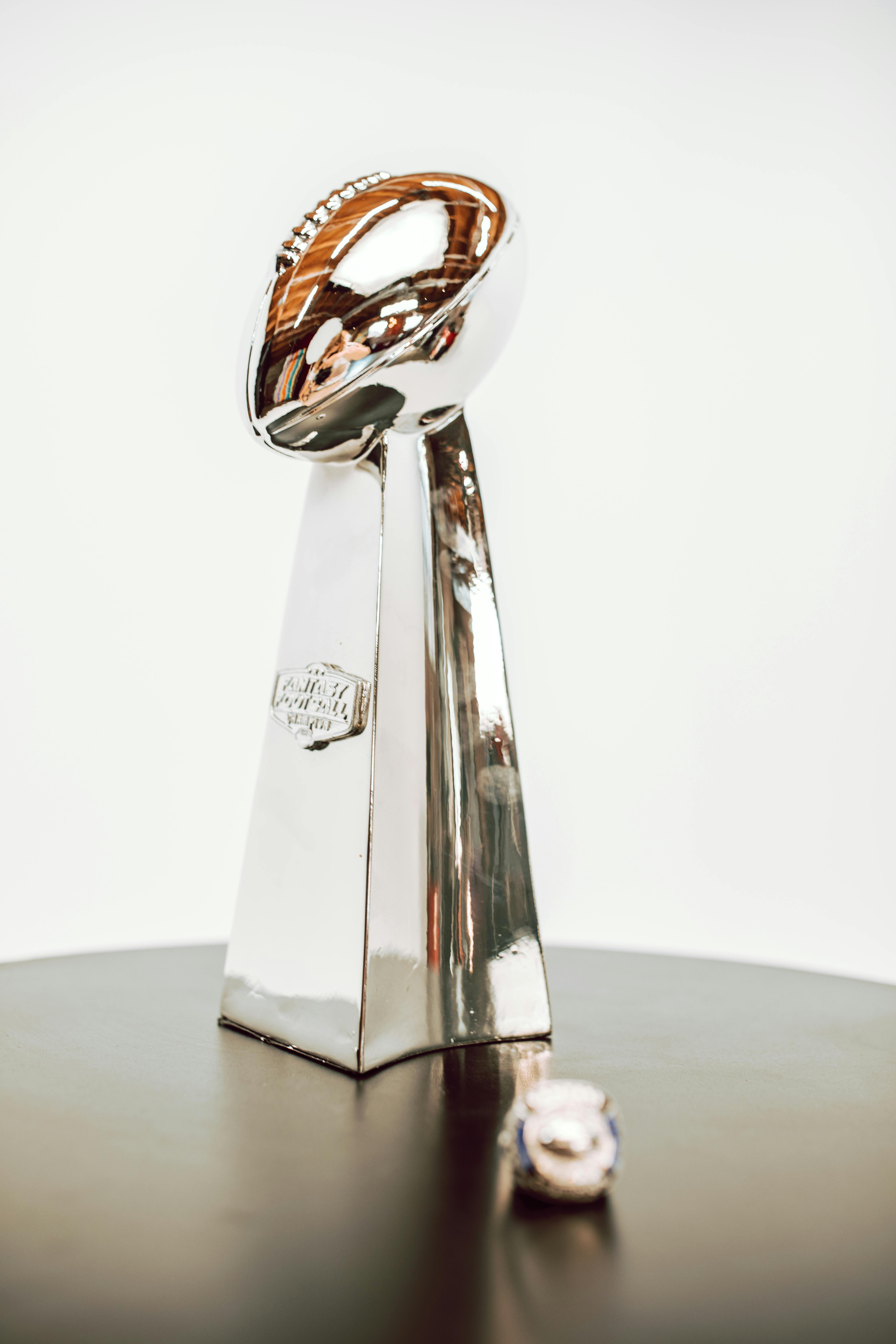 A Man's Face of Victory Holding His Trophy · Free Stock Photo