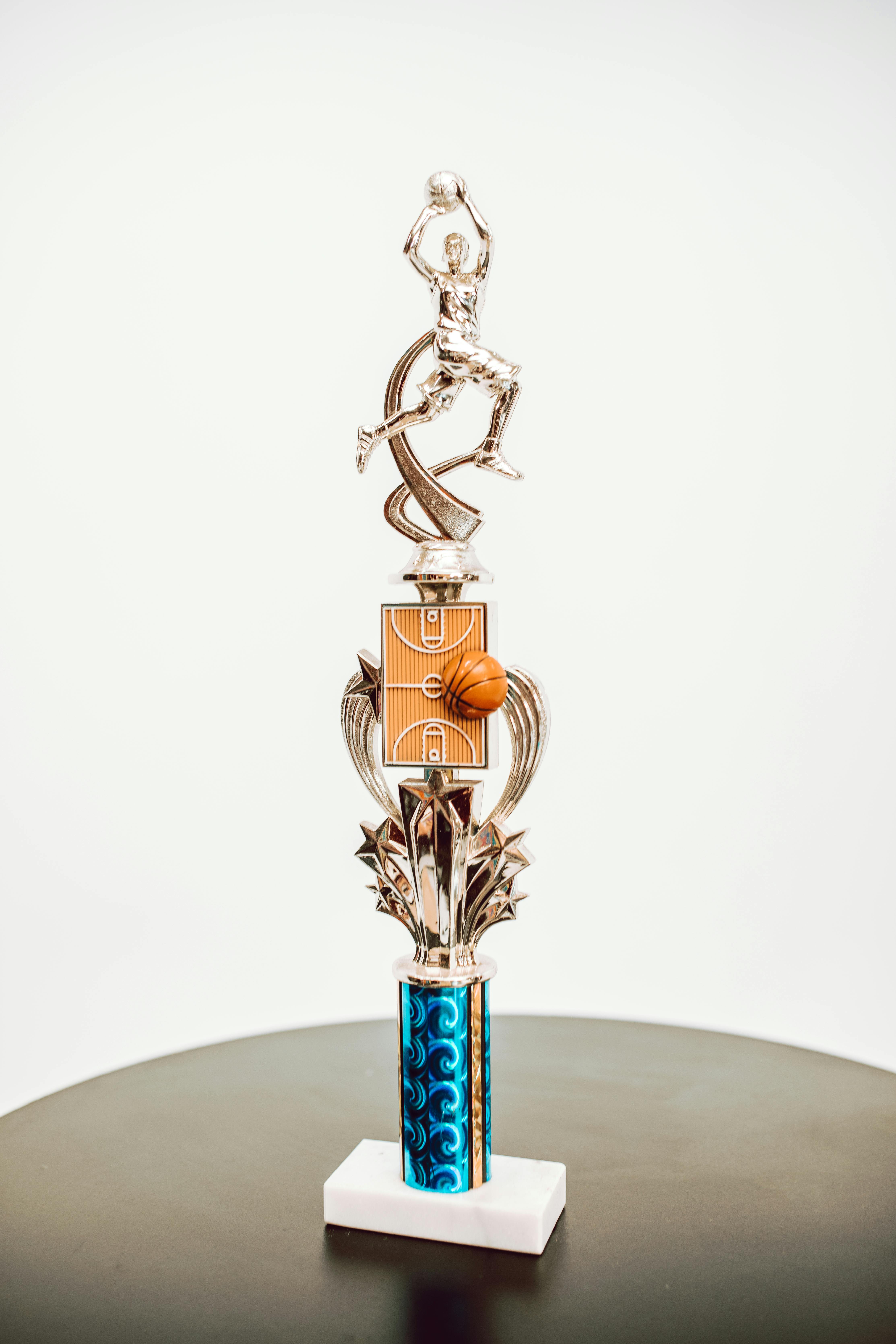 Gold and White Trophy on Table Top · Free Stock Photo