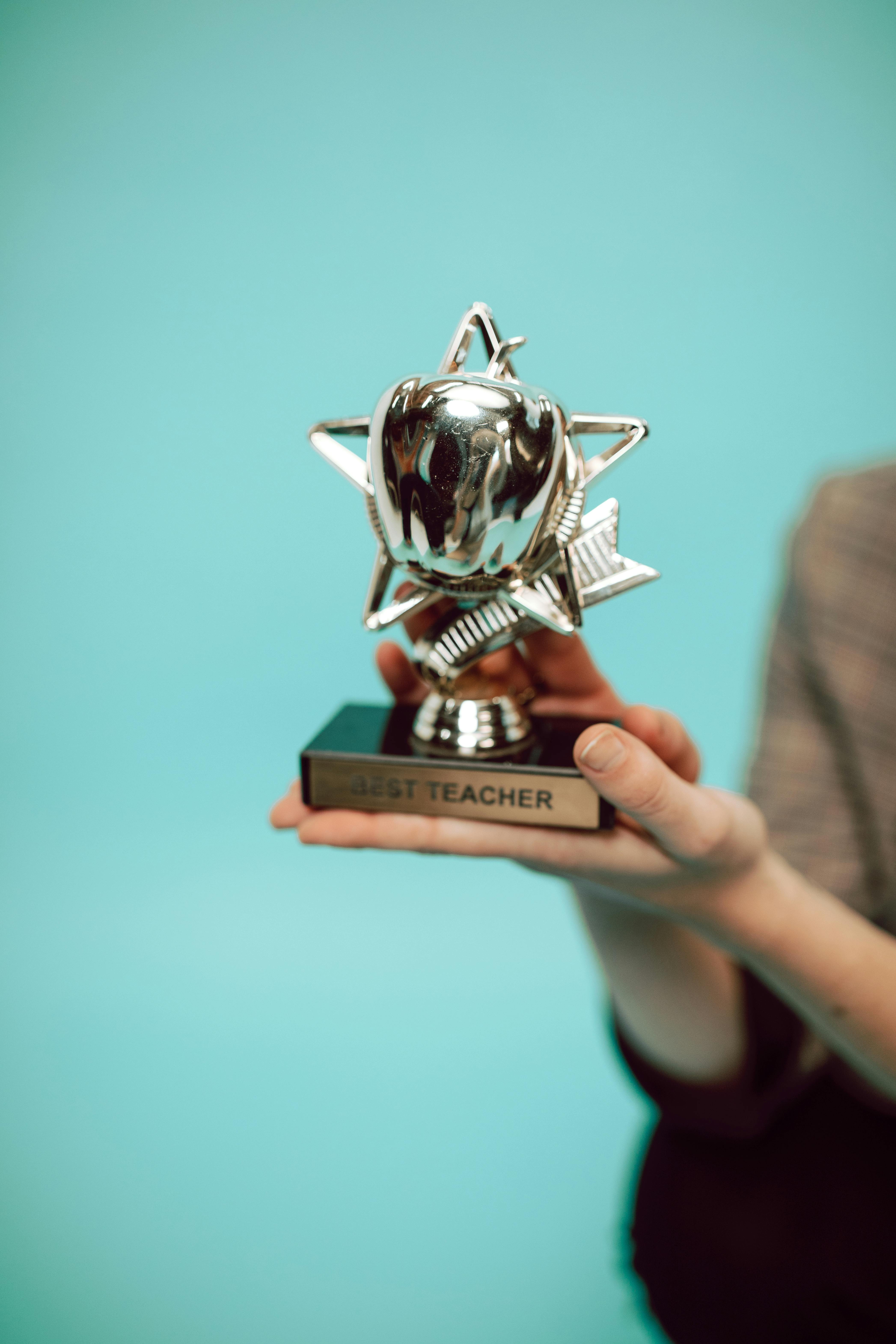 Man Holding a Trophy · Free Stock Photo